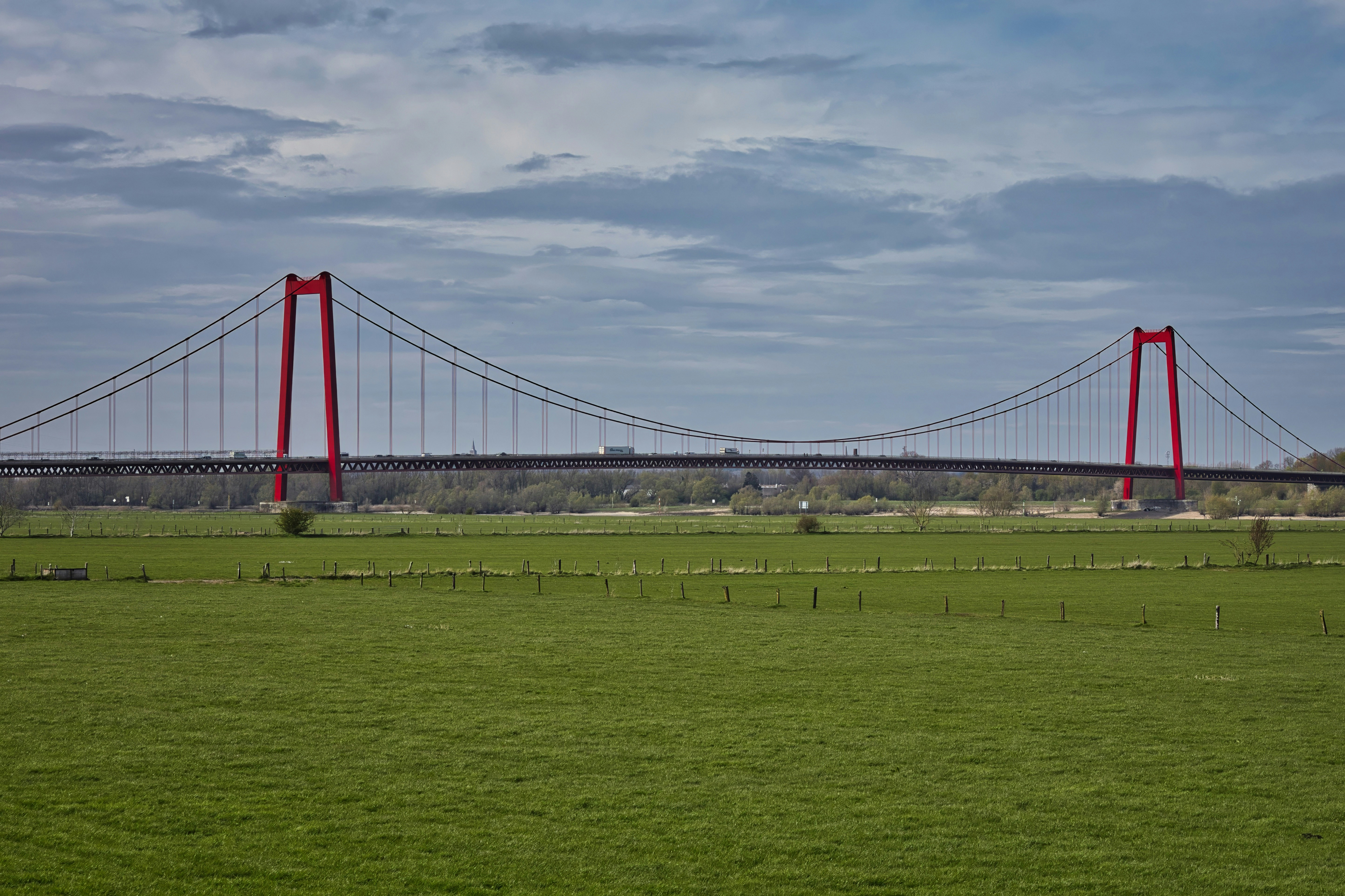 Red Cable-Stayed Span Over Open Fields