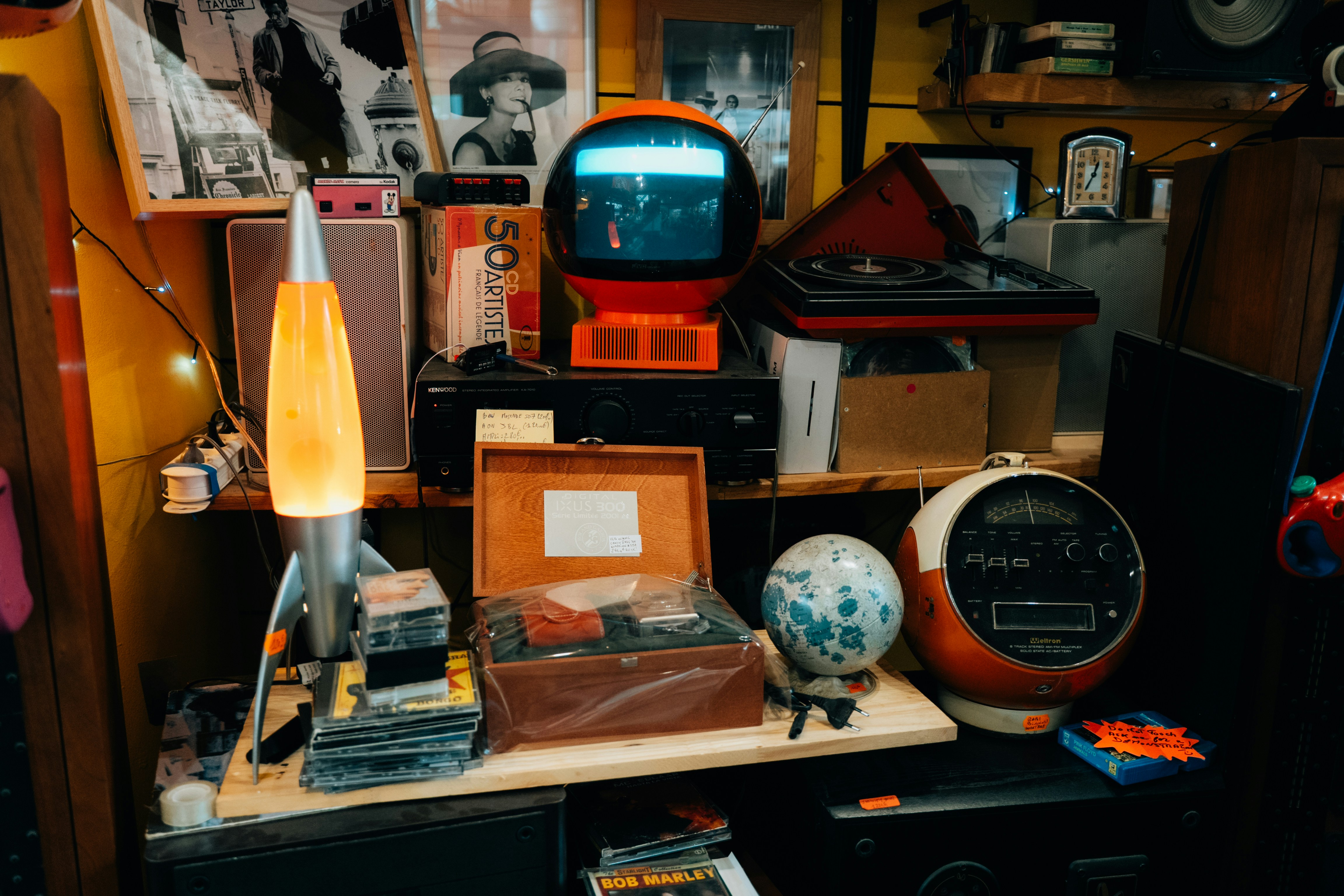 Nostalgia Shelf: A Vintage Tech Ensemble in Warm Indoor Light