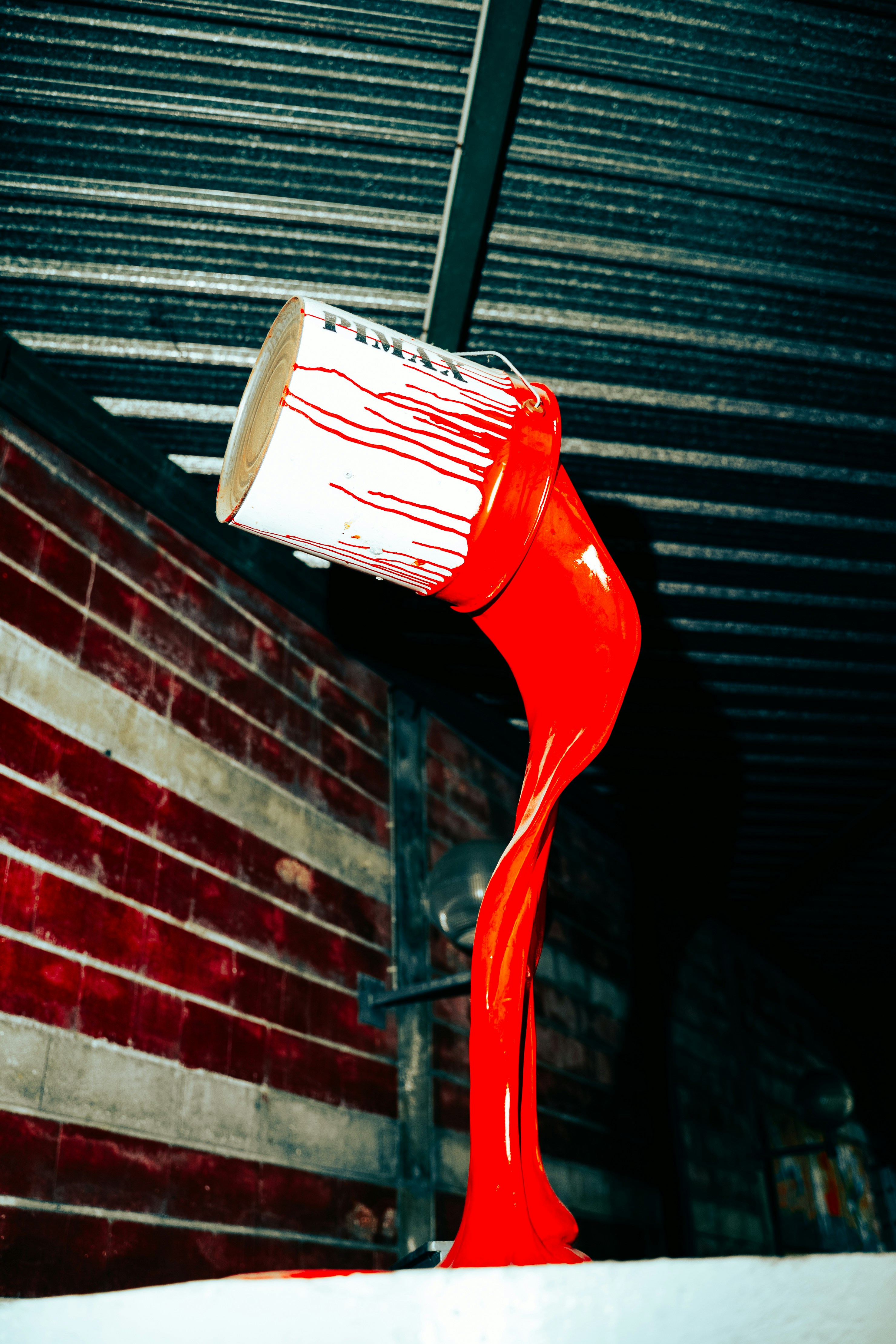 Dramatic Red Paint Pour over a Drip-Ready Can