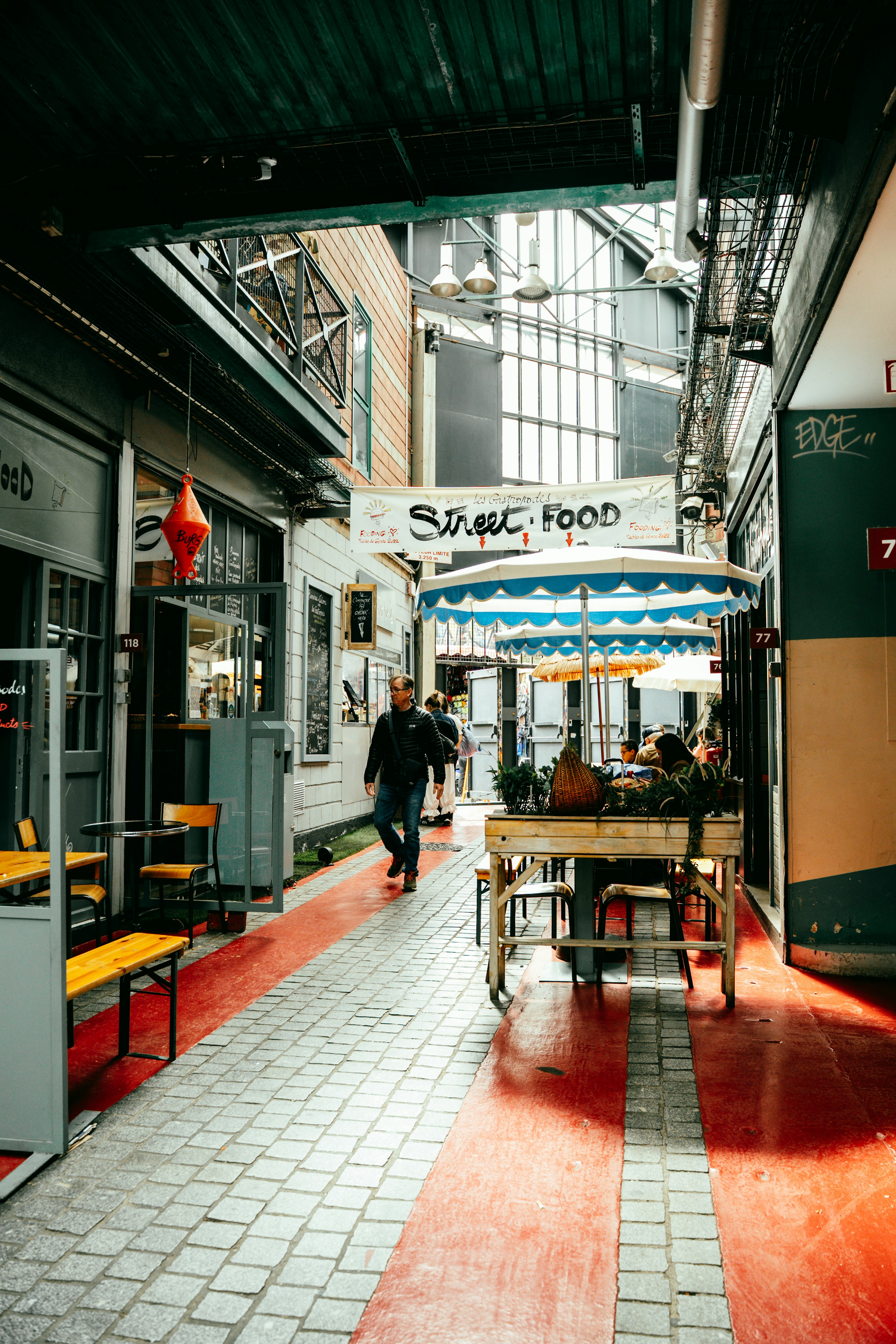 Street Food Alley: A Sunlit Corridor of Cafés and Fresh Market Tables