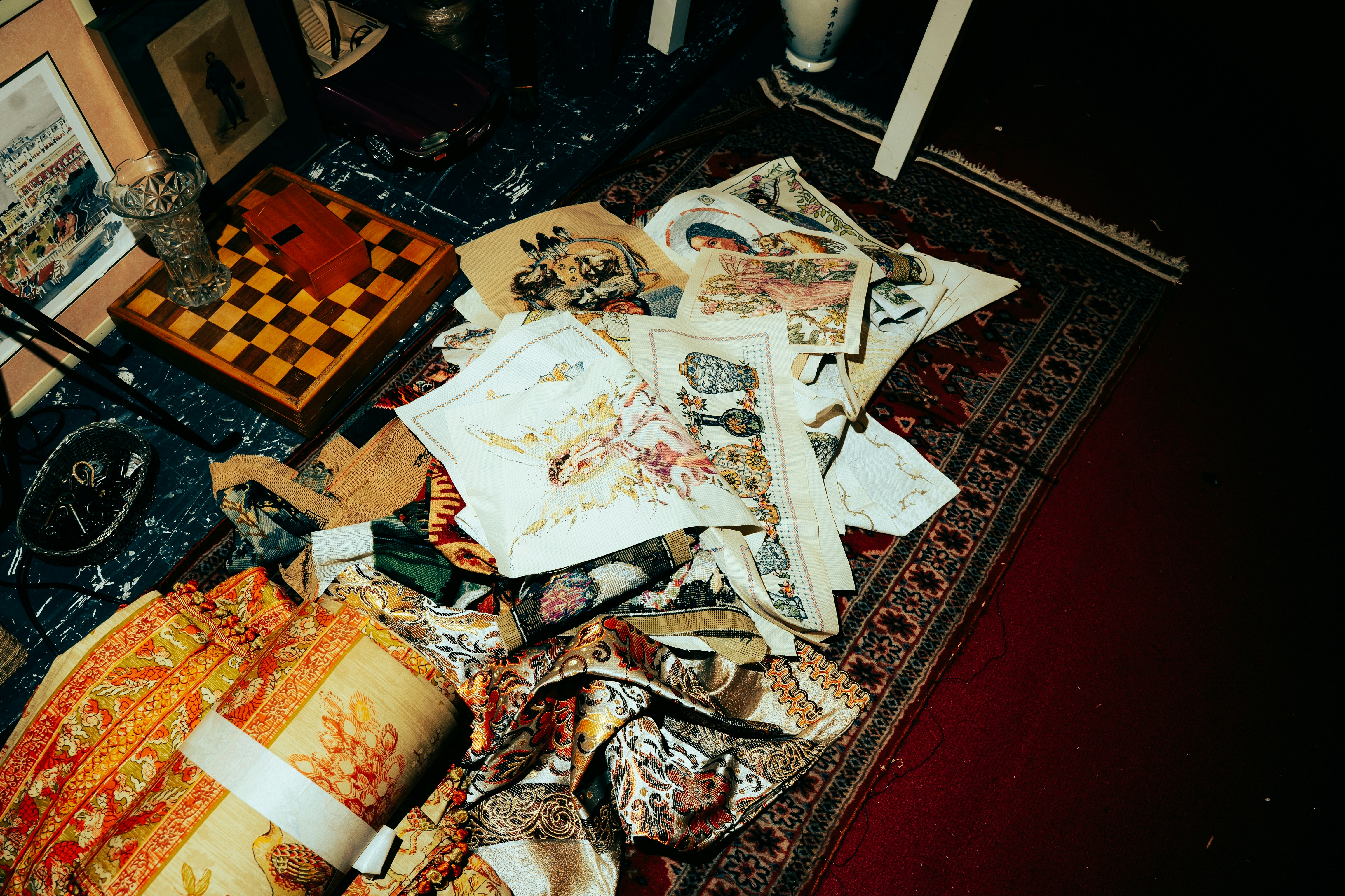 Mess of Artwork and Textiles: A Collage on a Rug
