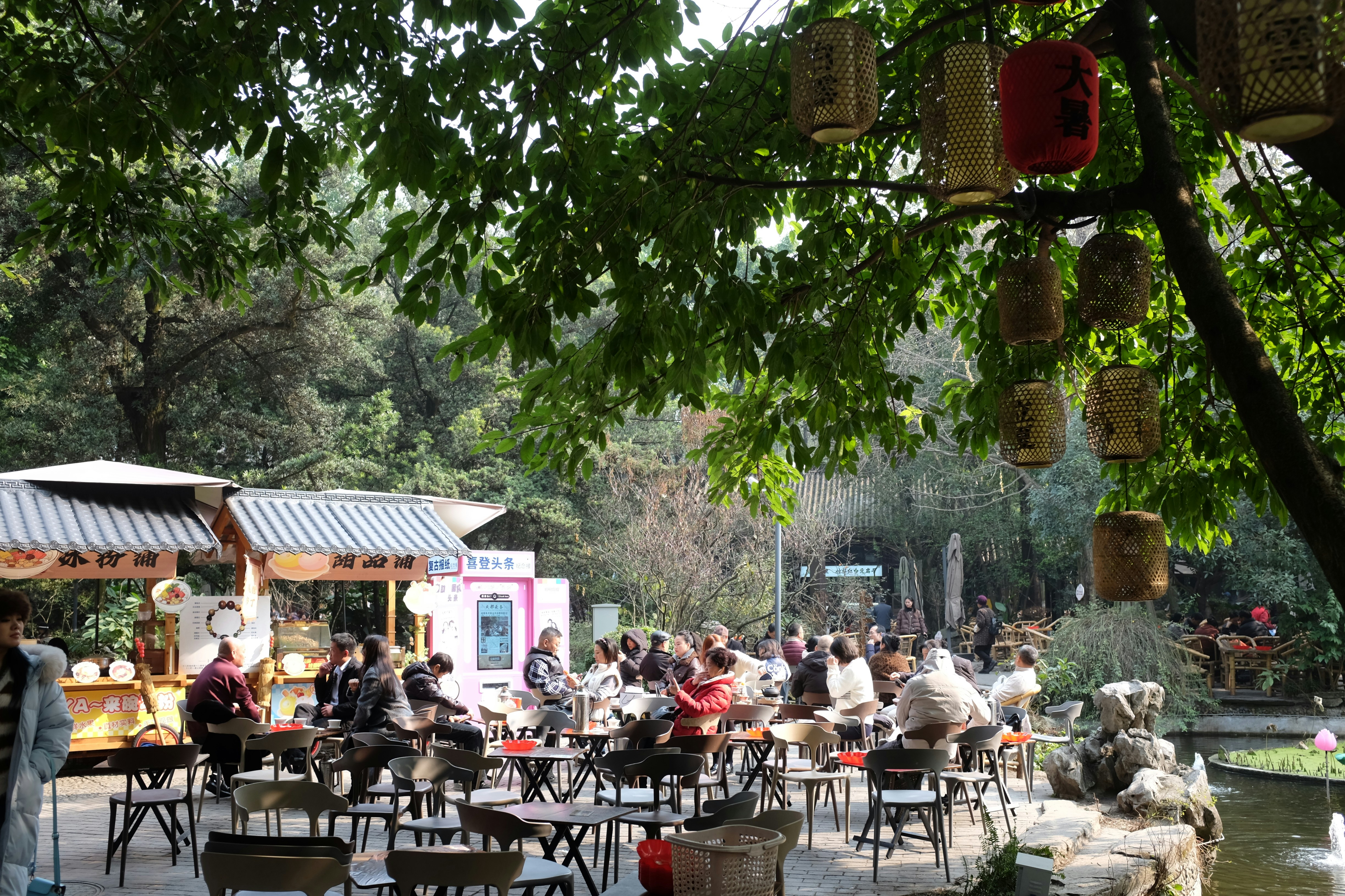Tea garden plaza under lanterns: a leisure scene at dusk