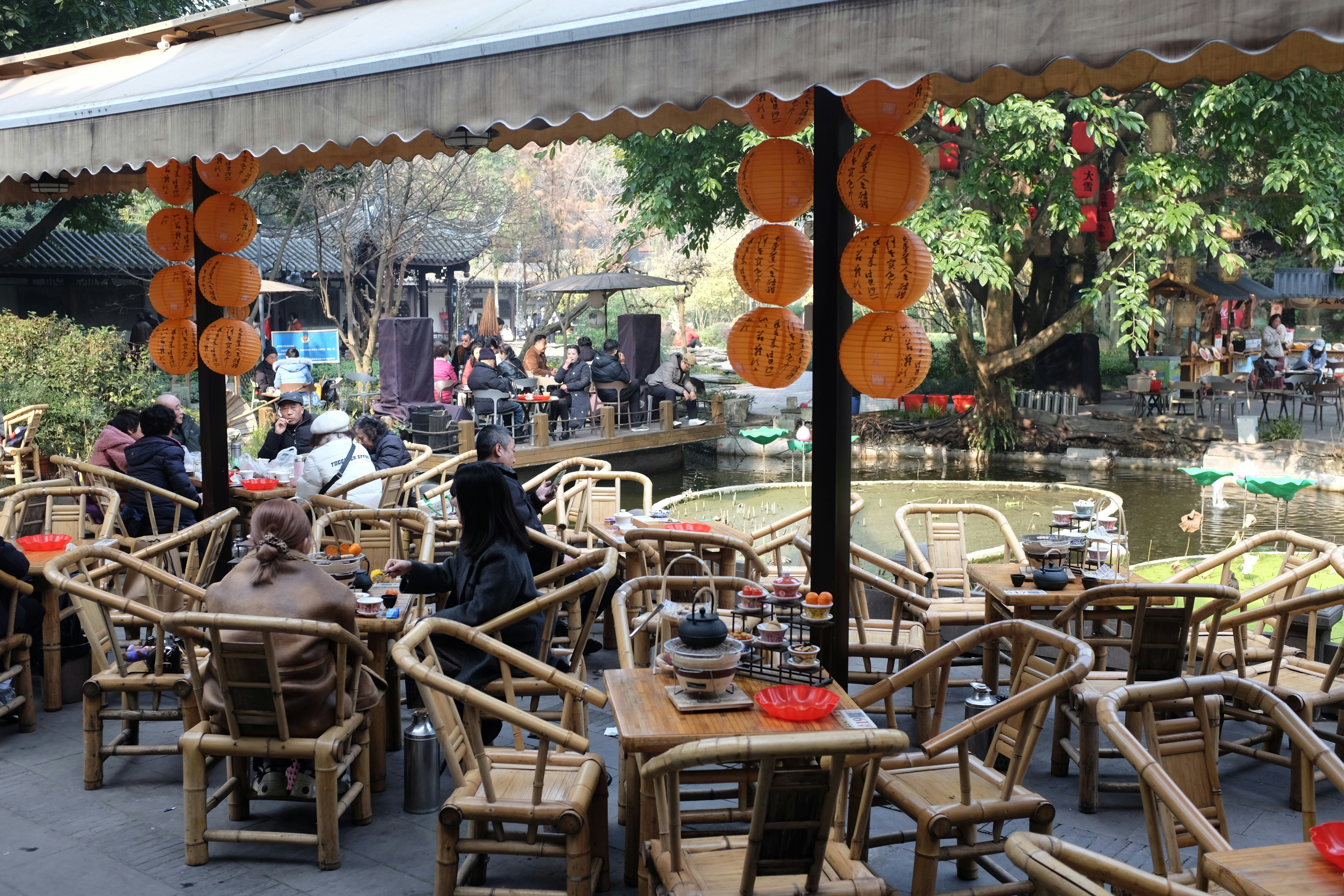 Lantern-lit Terrace: Calm Café Life by the Canal