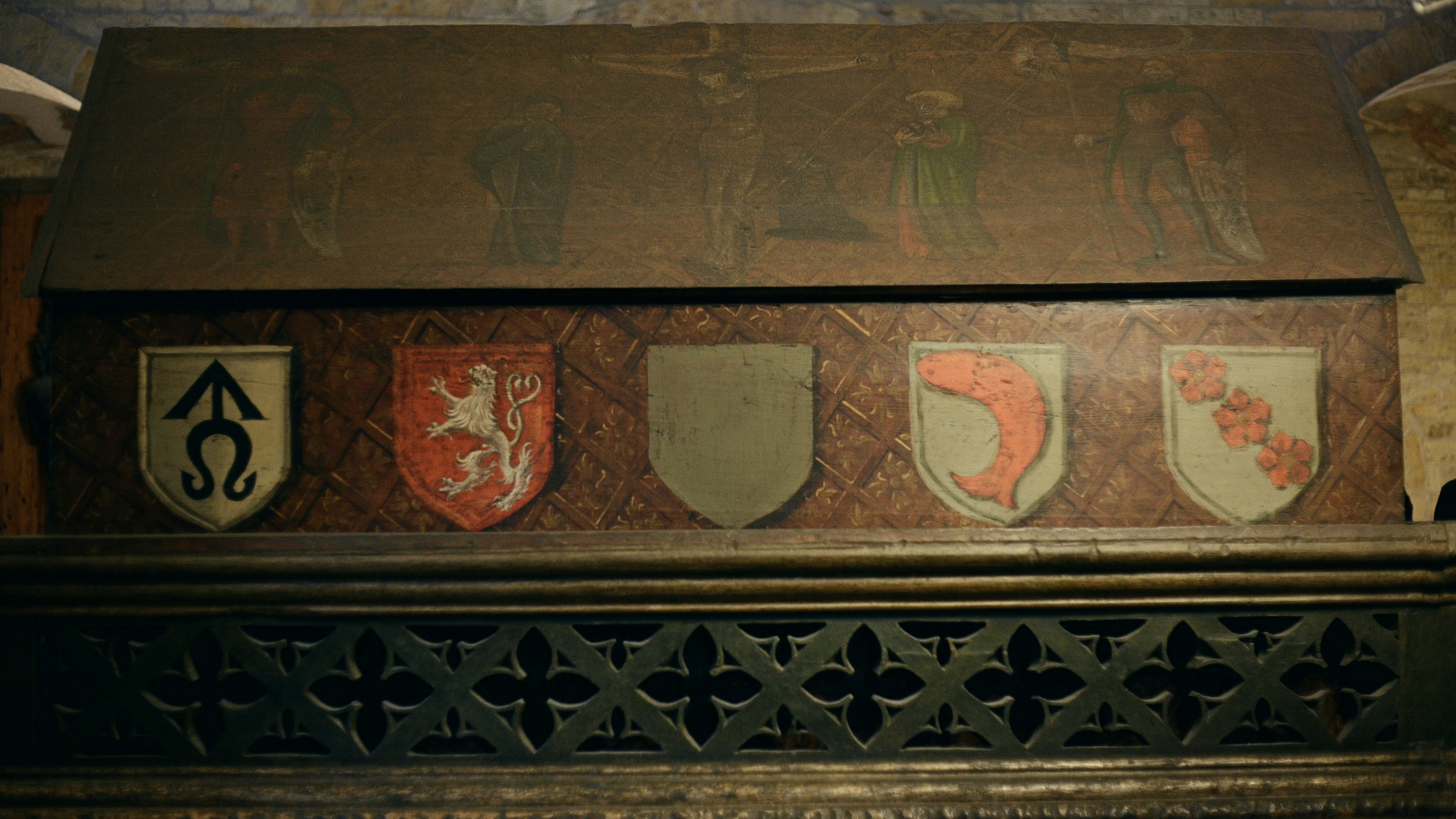 Heraldic Shields Beneath a Diminutive Gabled Roof