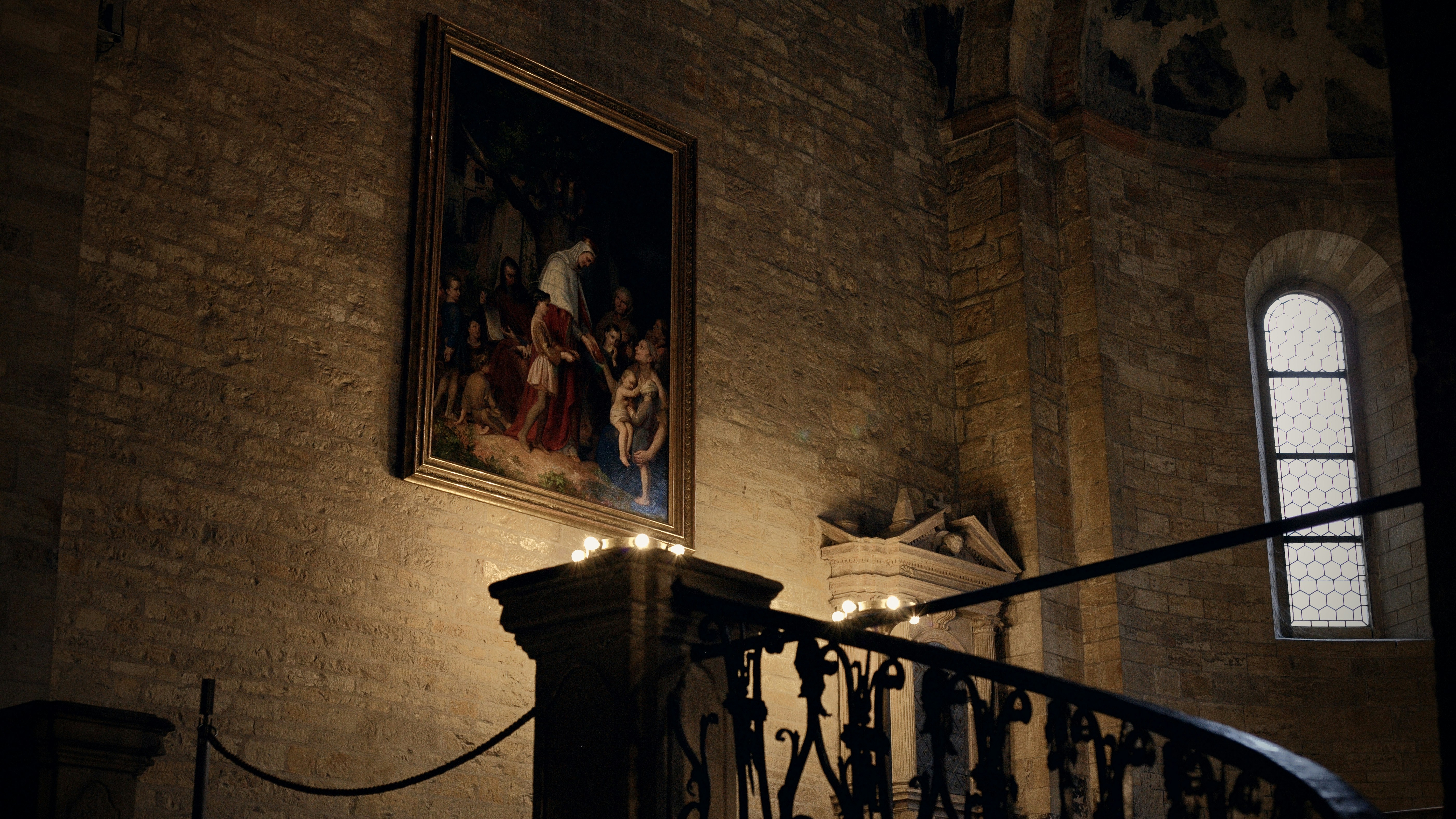 Stone-lit Gallery: A Framed Masterpiece Surrounded by Antiquity