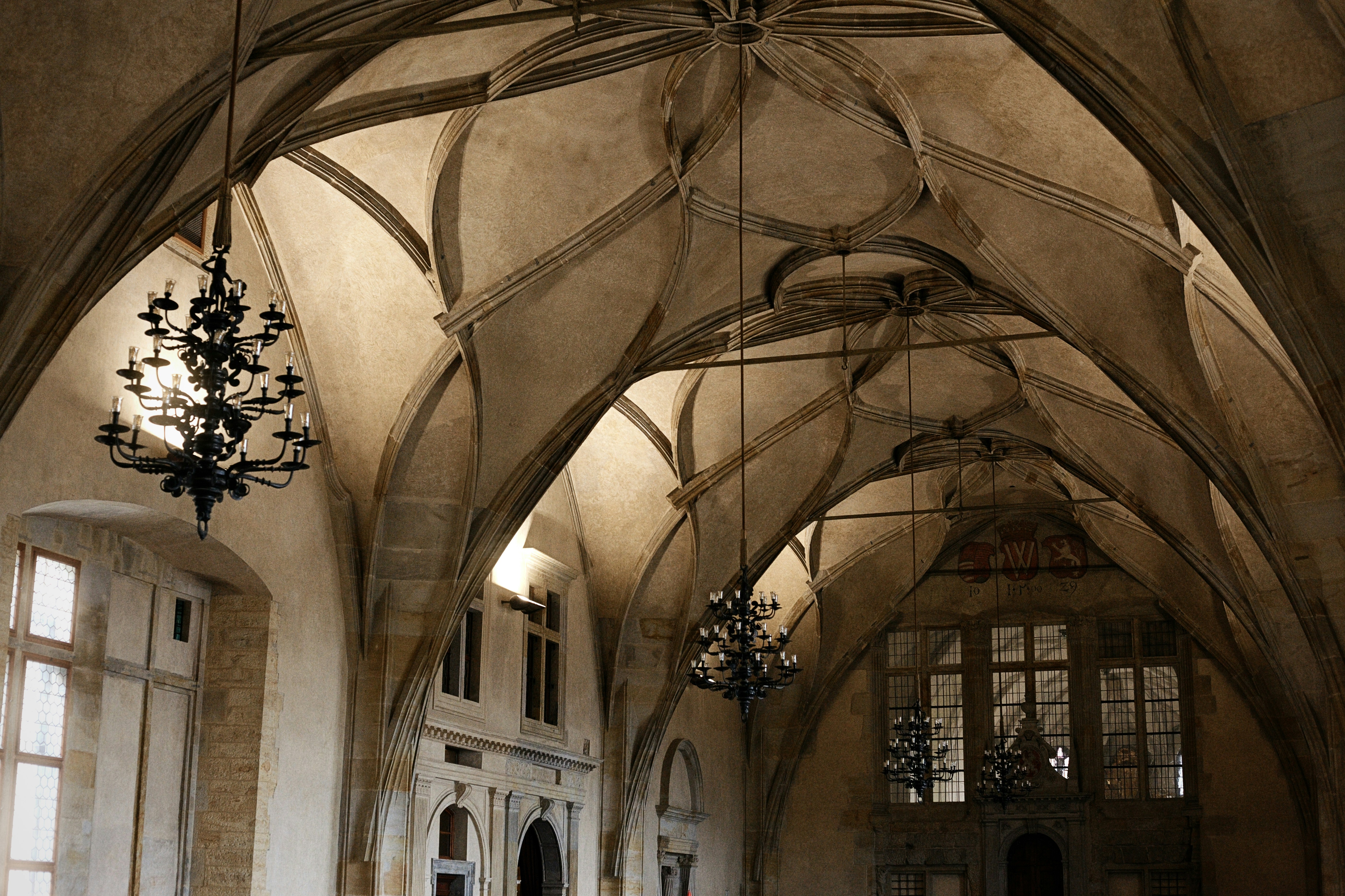 Gothic Vaults and Chandeliers: A Cathedral Interior in Soft Sepia Light
