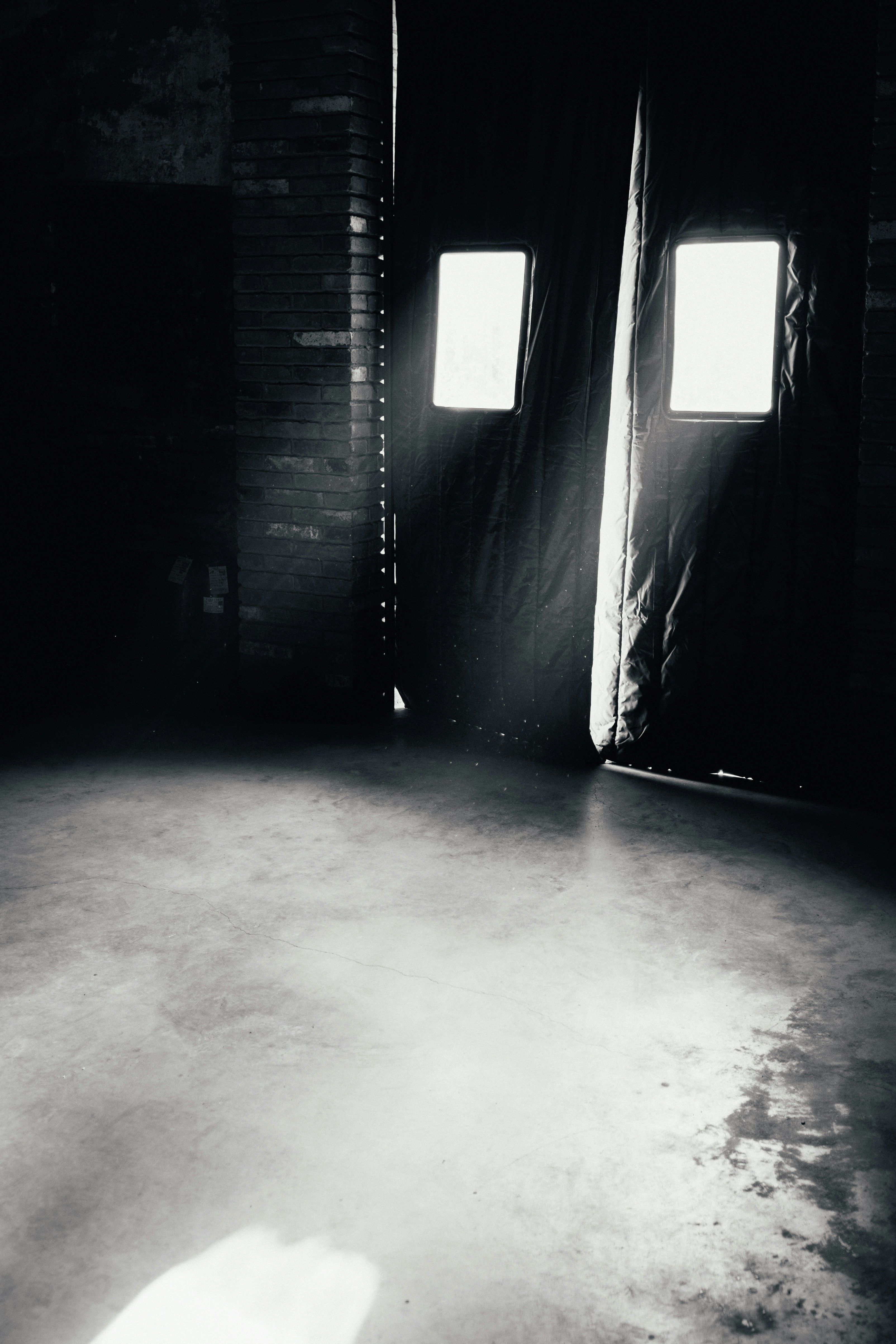 Industrial Teardrop: Light Through a Veiled Doorway