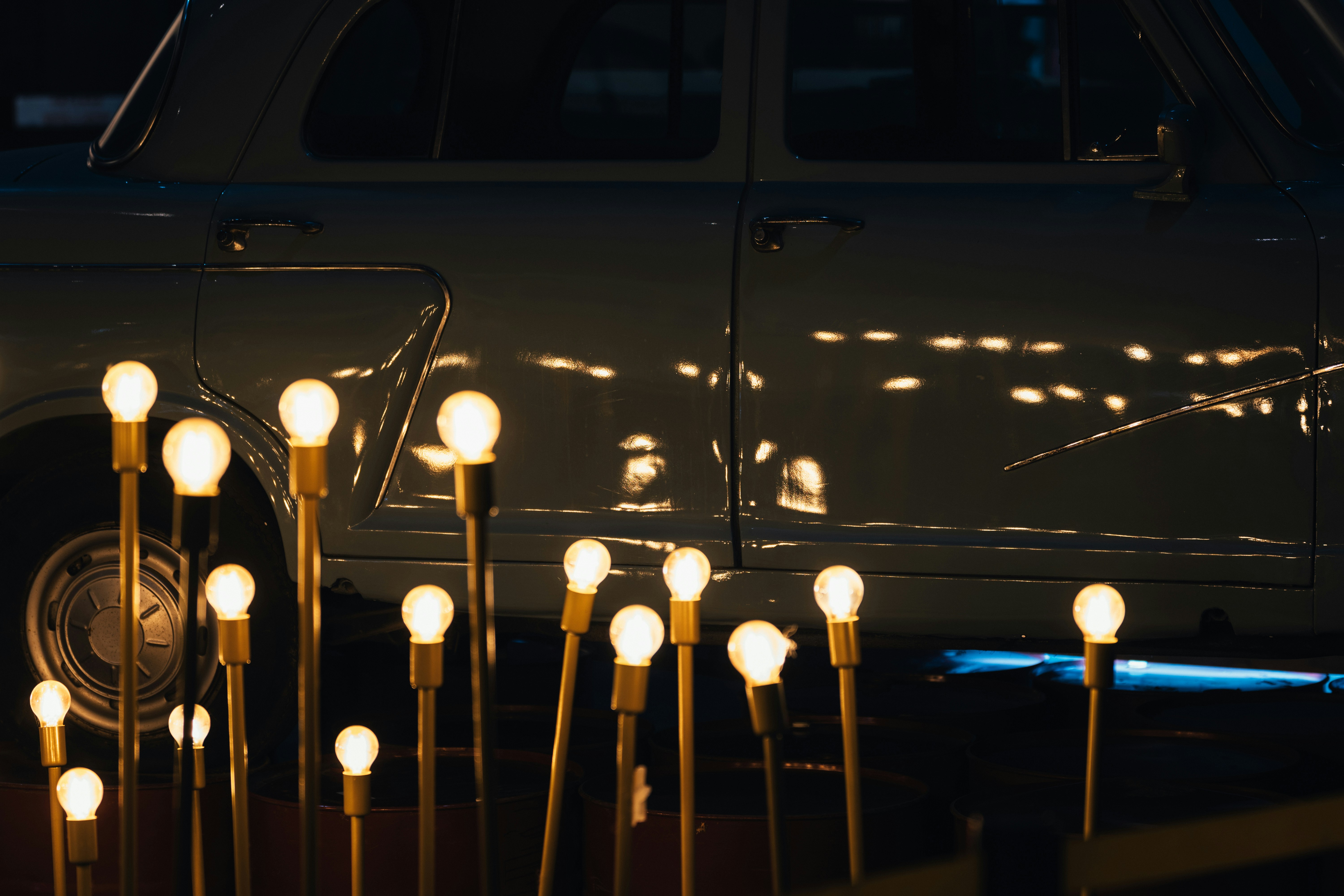 Glowing Orbs Before the Midnight Car
