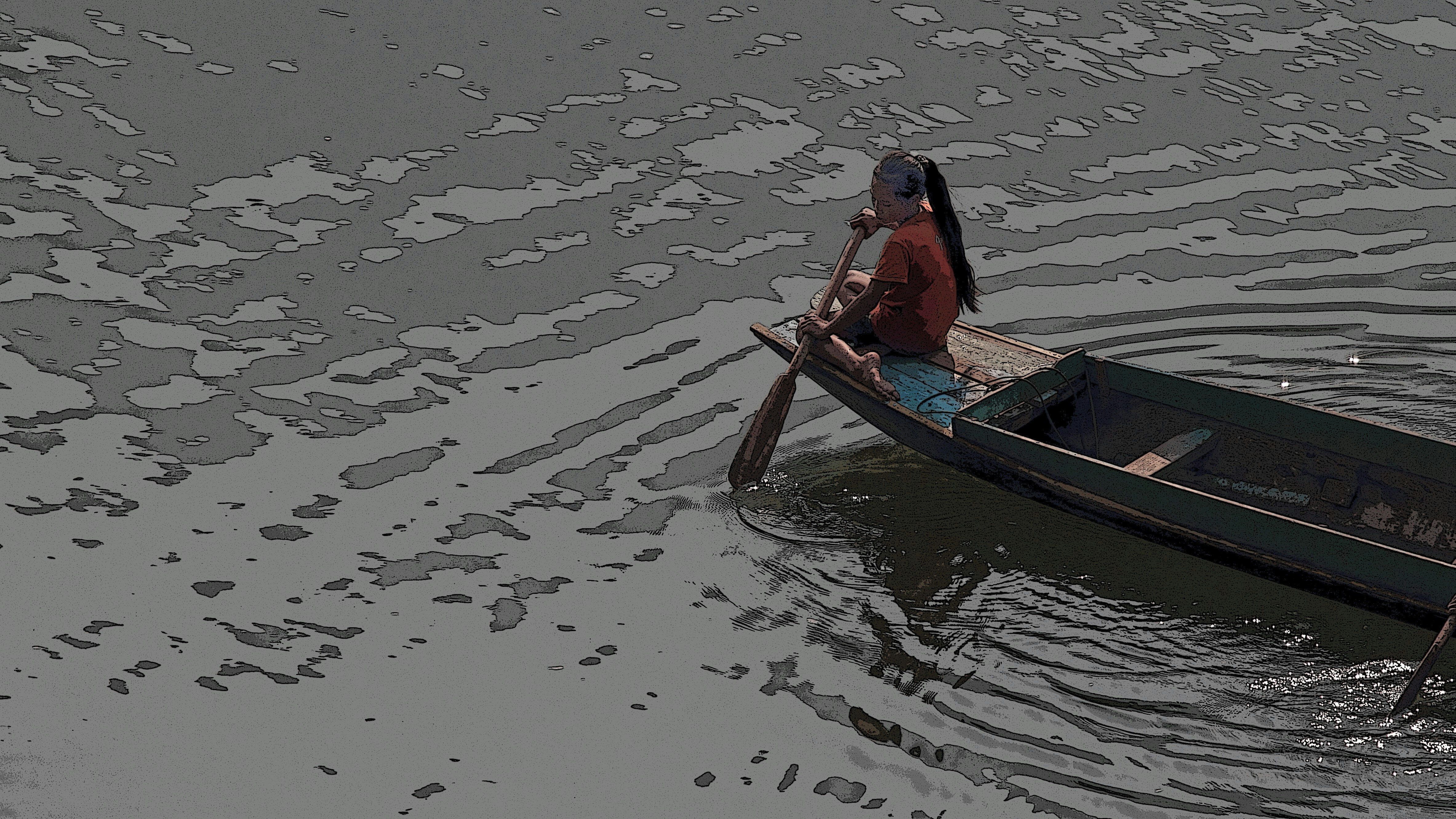 Oars in Quiet Riverscape: A Lone Rower Stirs the Afternoon