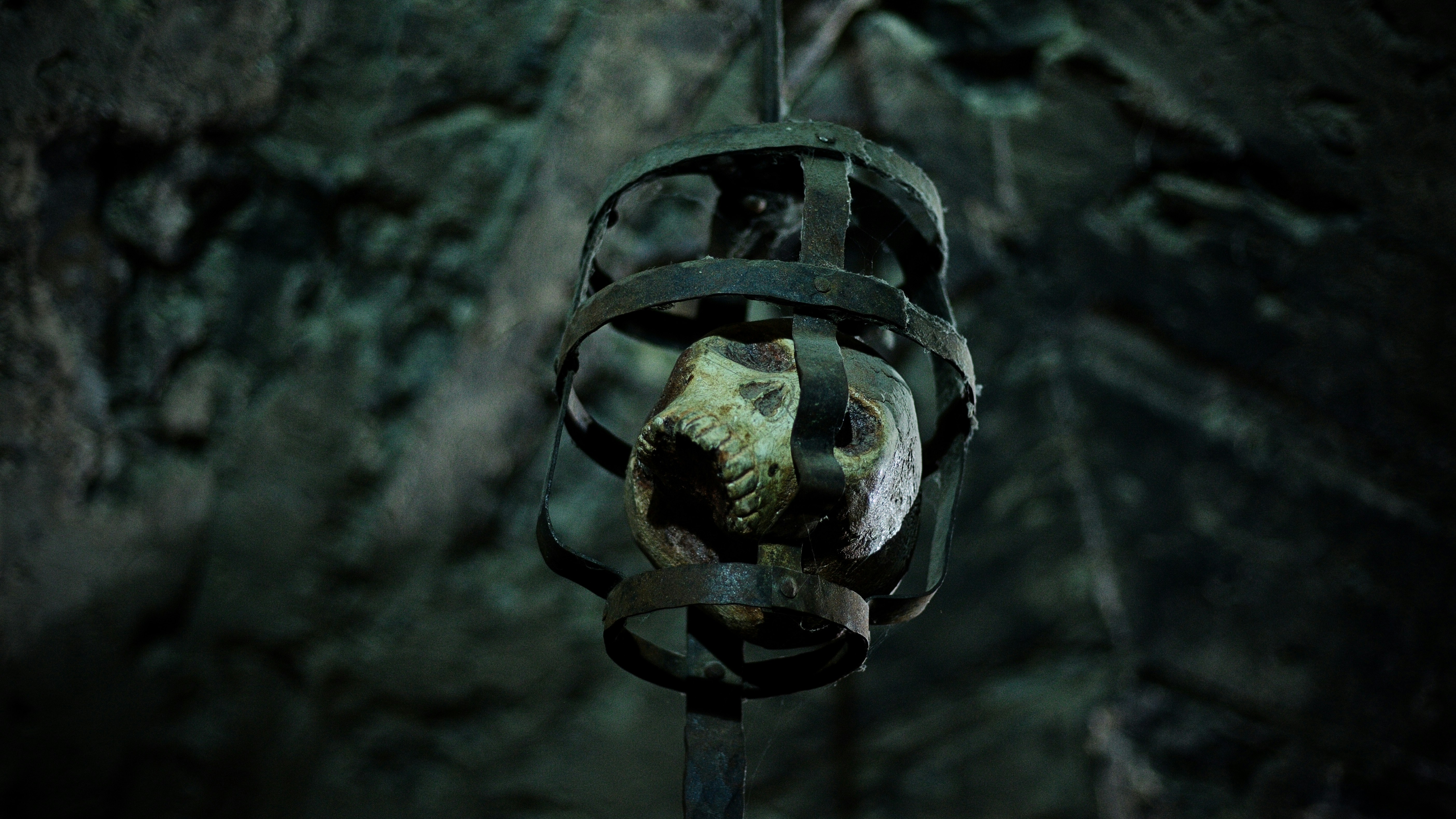 The Enigmatic Orbital Cage in a Coal-Dusted Portrait