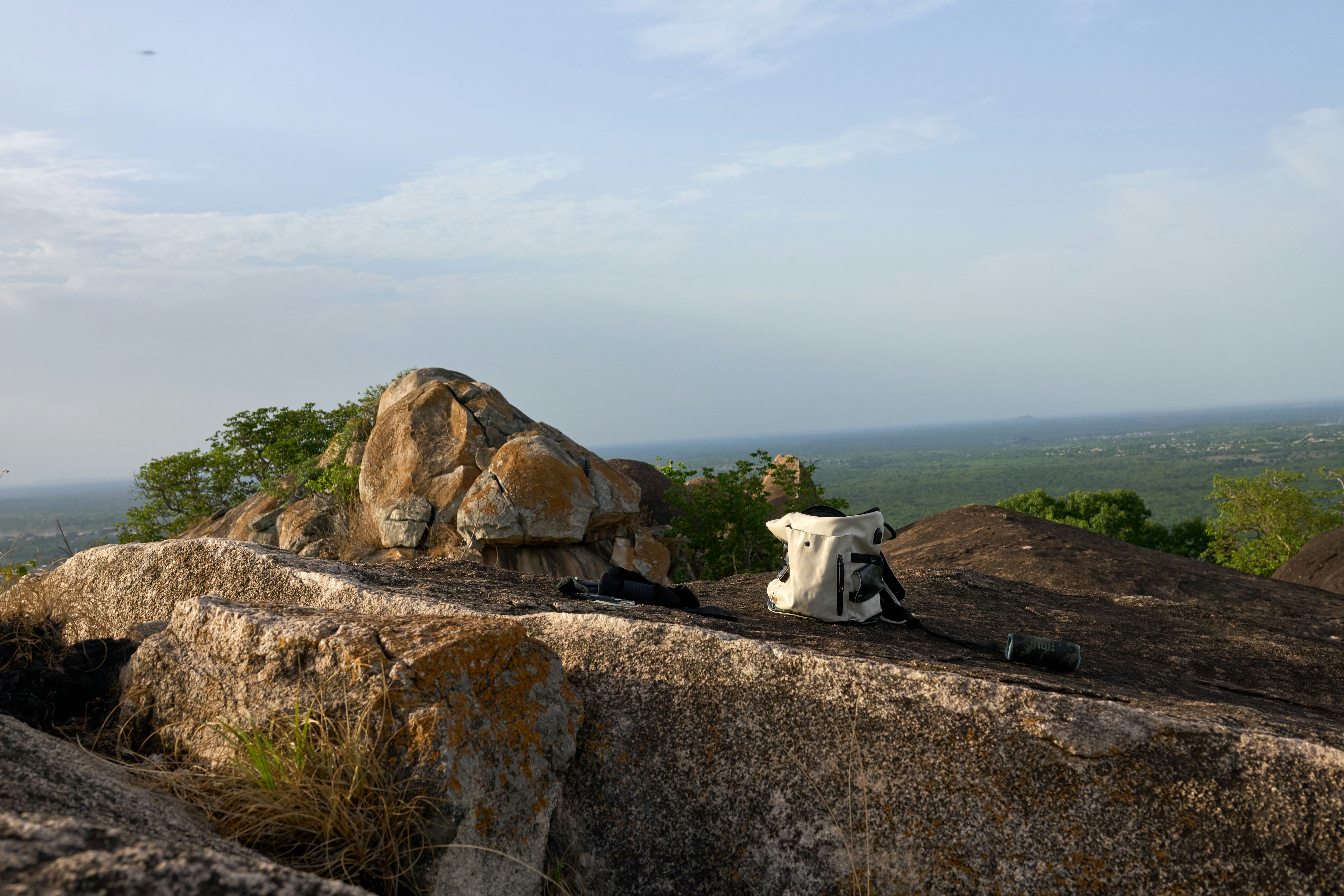 Traveler’s Gear Resting on the Elevated Granite: A Quiet Overlook