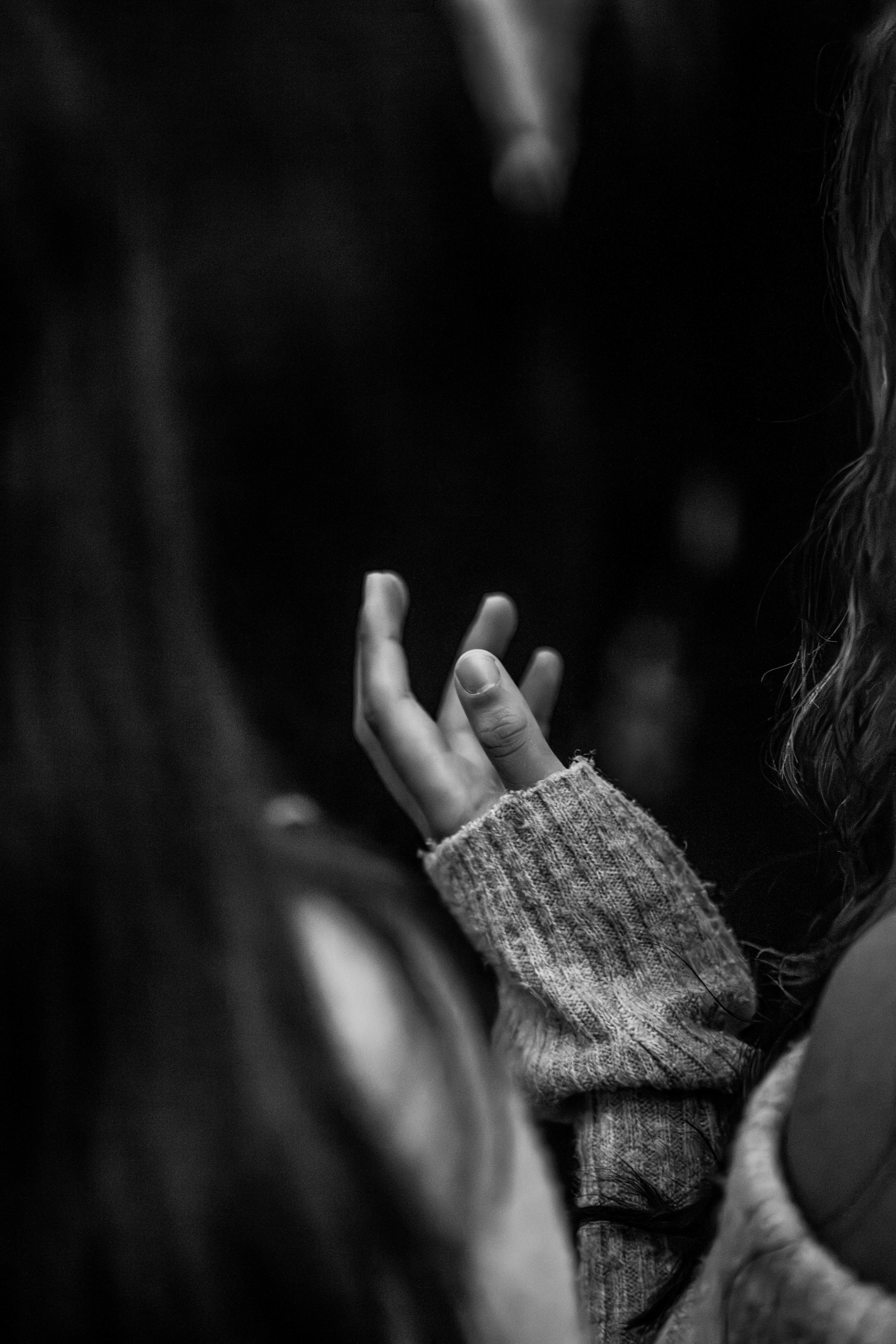 Hands in Focus: A Silent Moment Between Friends
