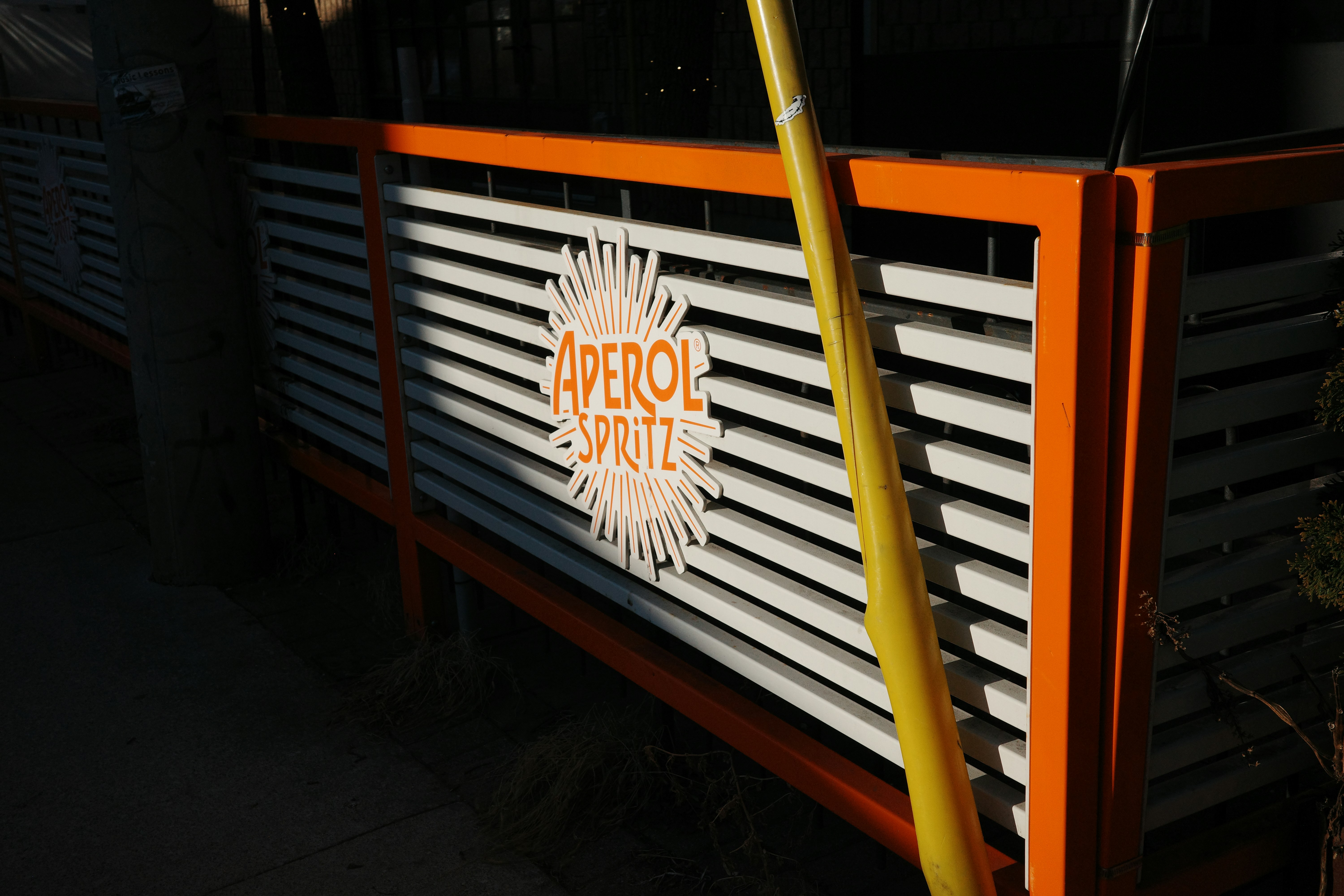 Orange Gate and Logo Illumination at Dusk