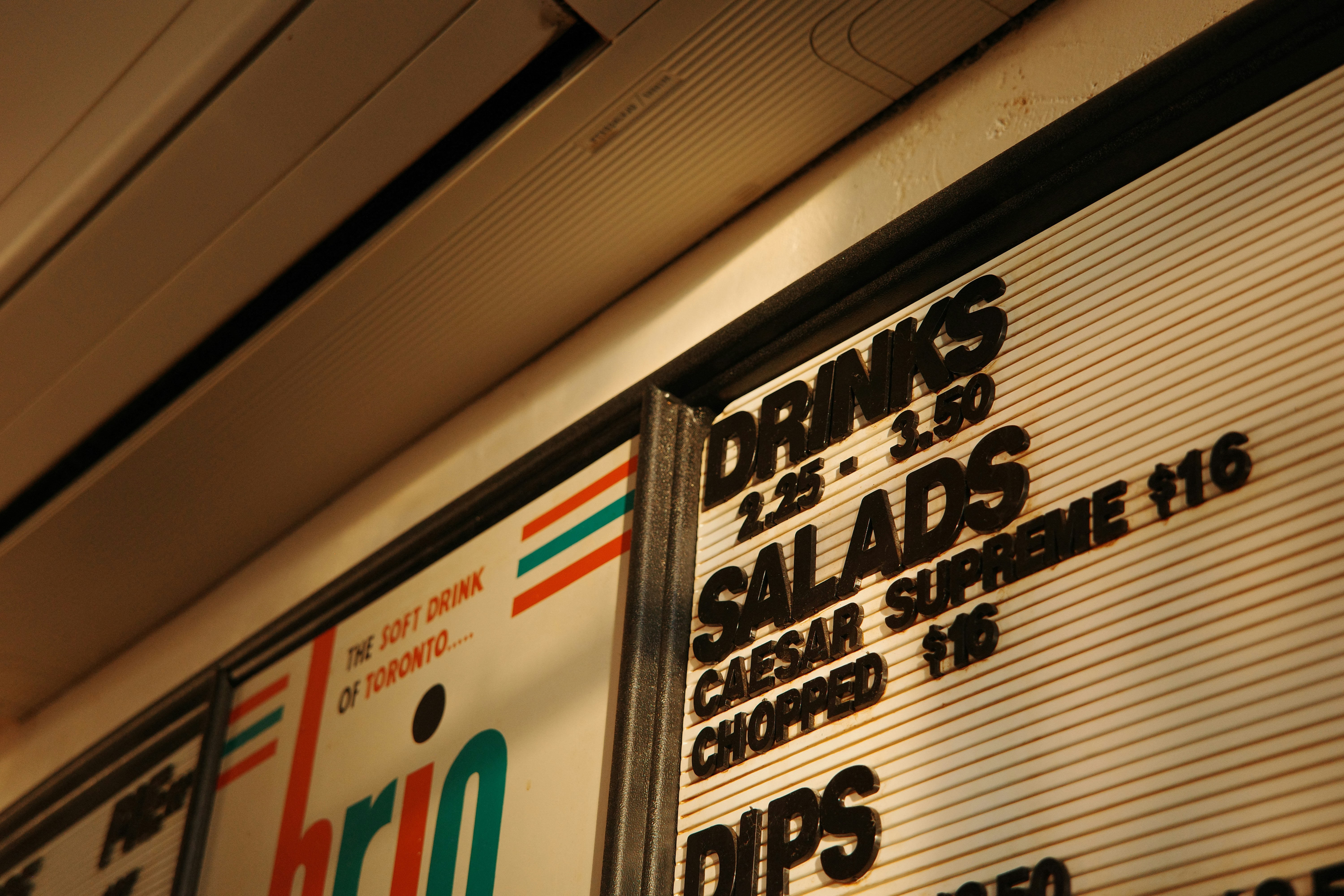 Neon Menu on a Tilted Window in a Retro Diner