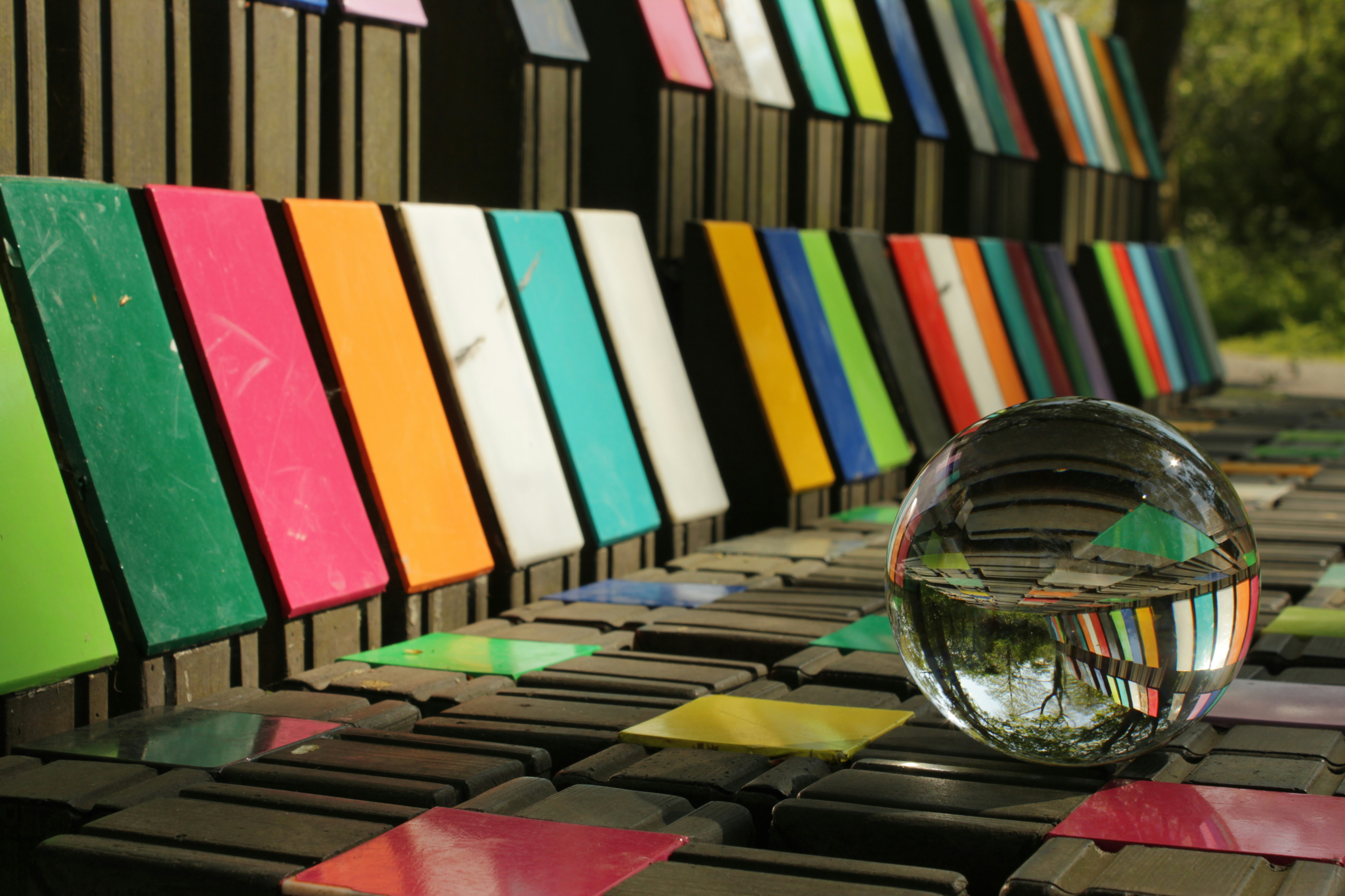 Colorful Tiles in Glass Sphere: A Quiet Playground of Reflections