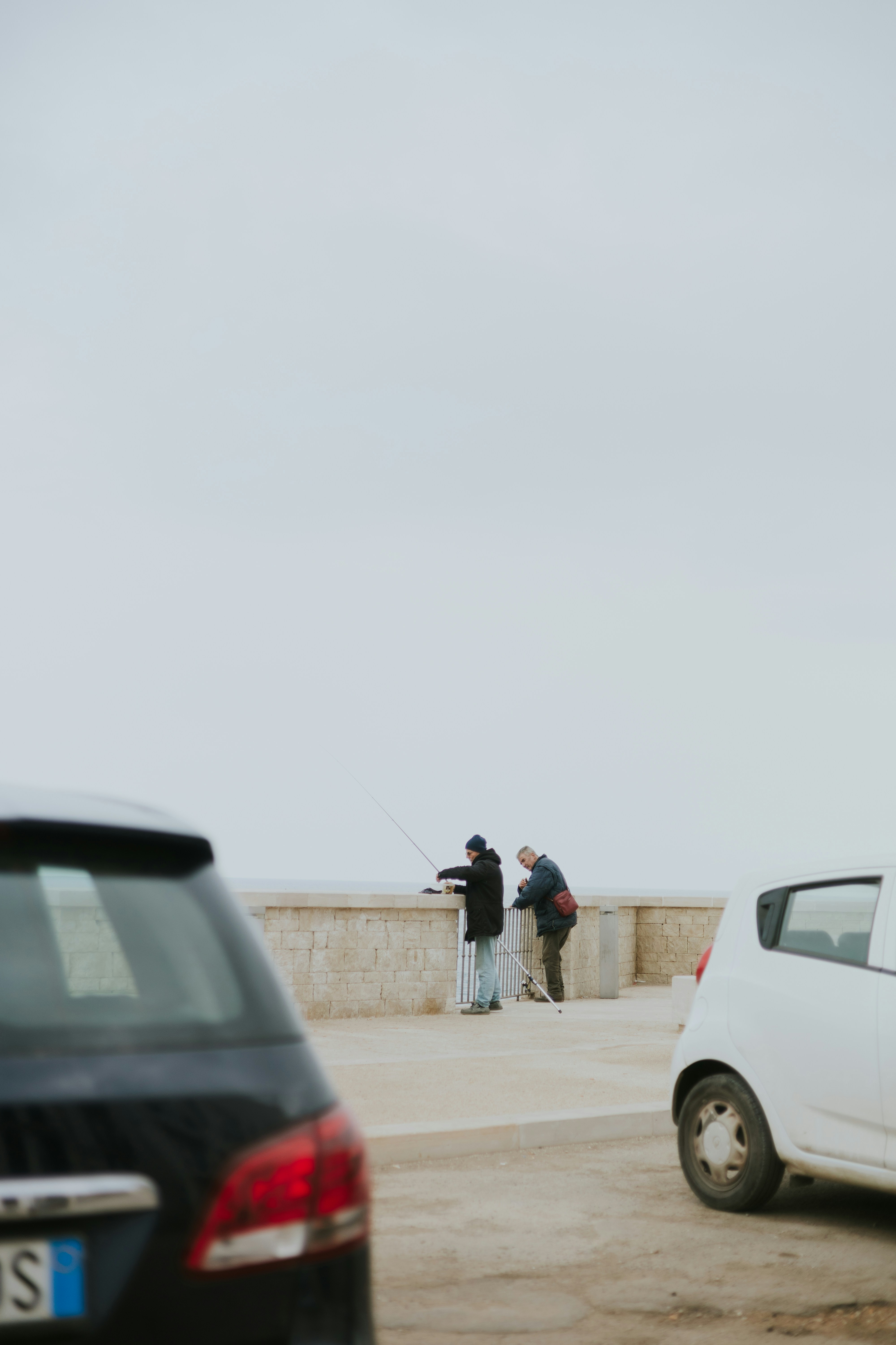 Lines of Light: Beachfront Anglers in Focus