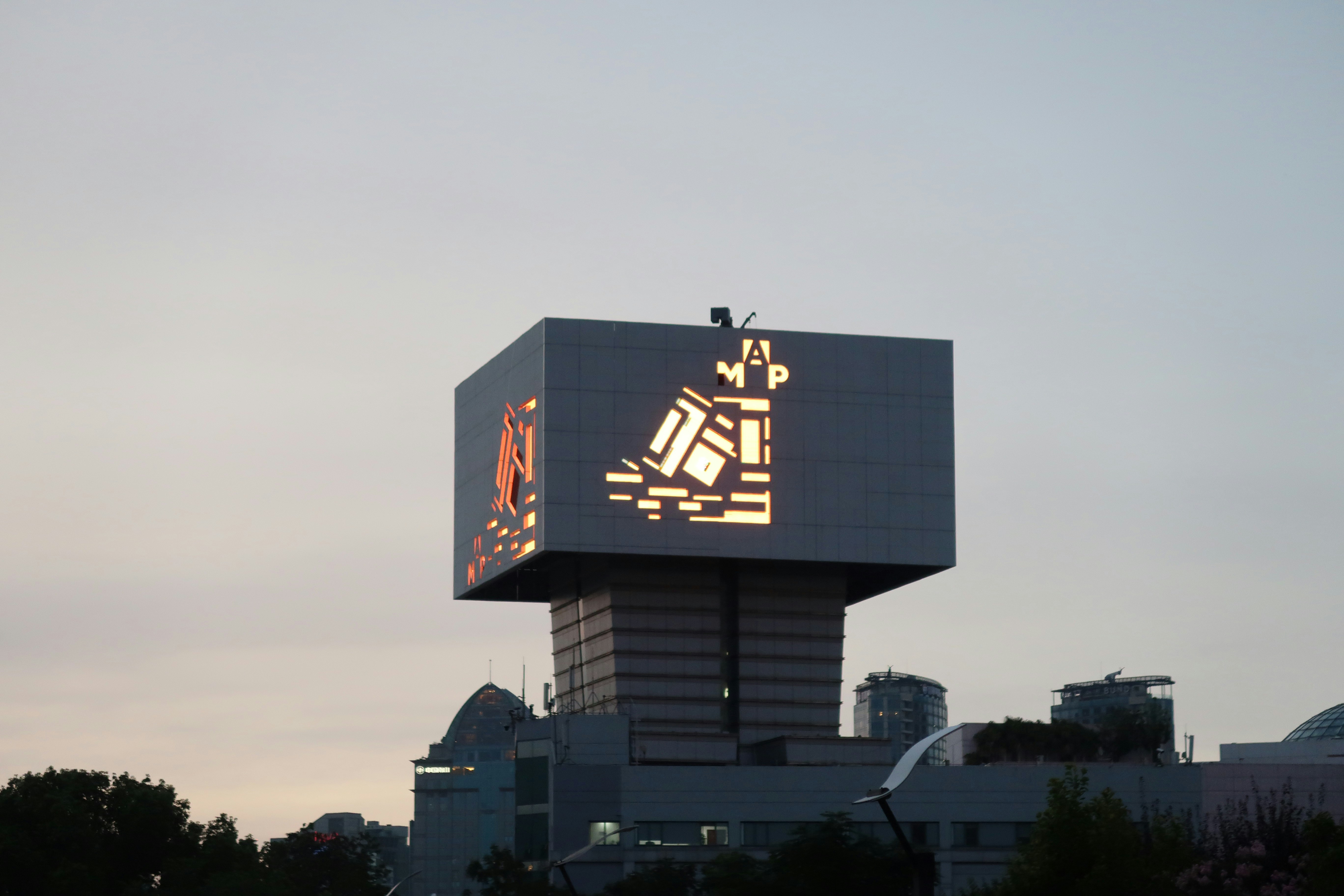 Illuminated Cube: The Observatory Tower Rising Above the City