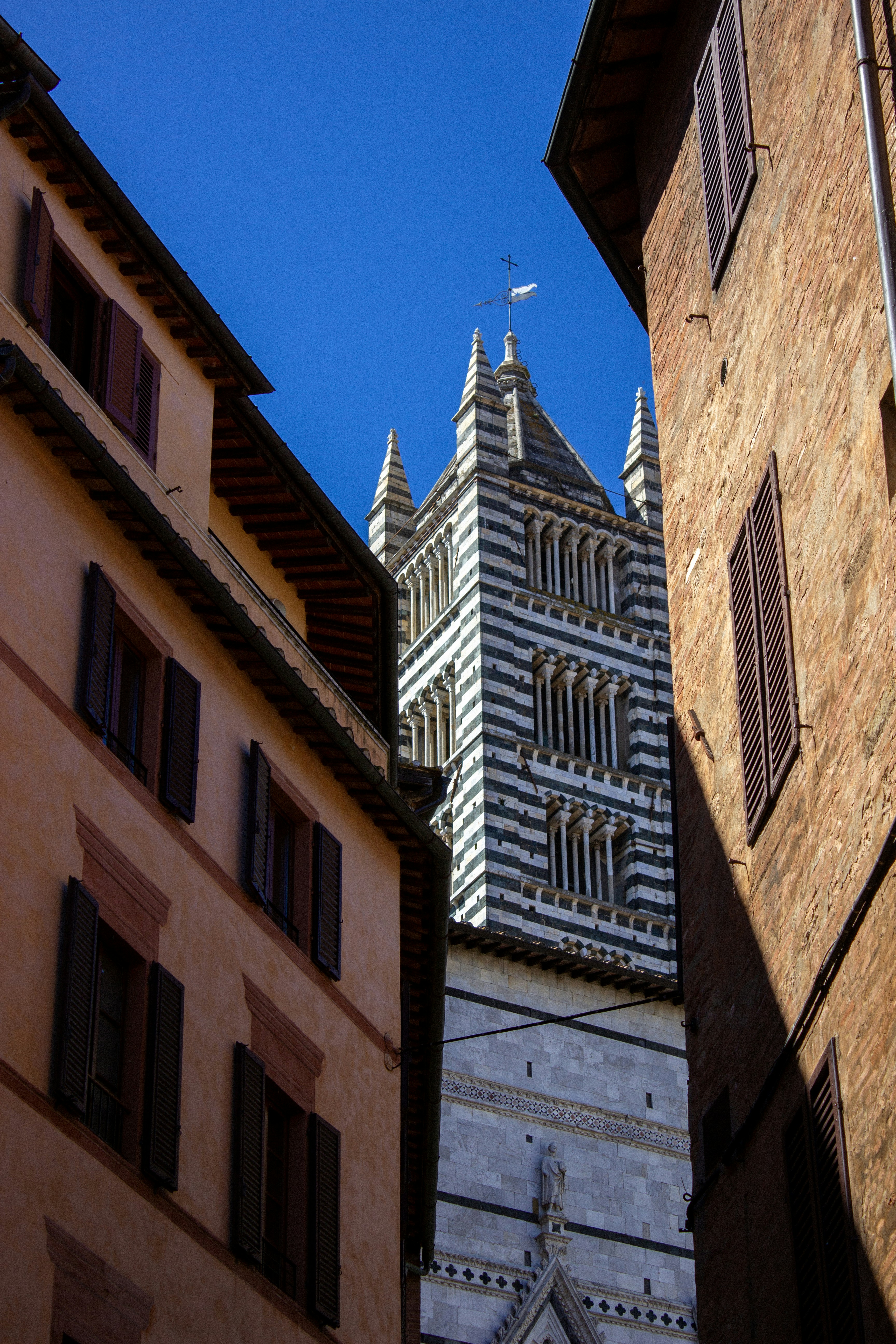 Strata Between Towers: A Narrow Florentine Vista to the Cathedral Spires