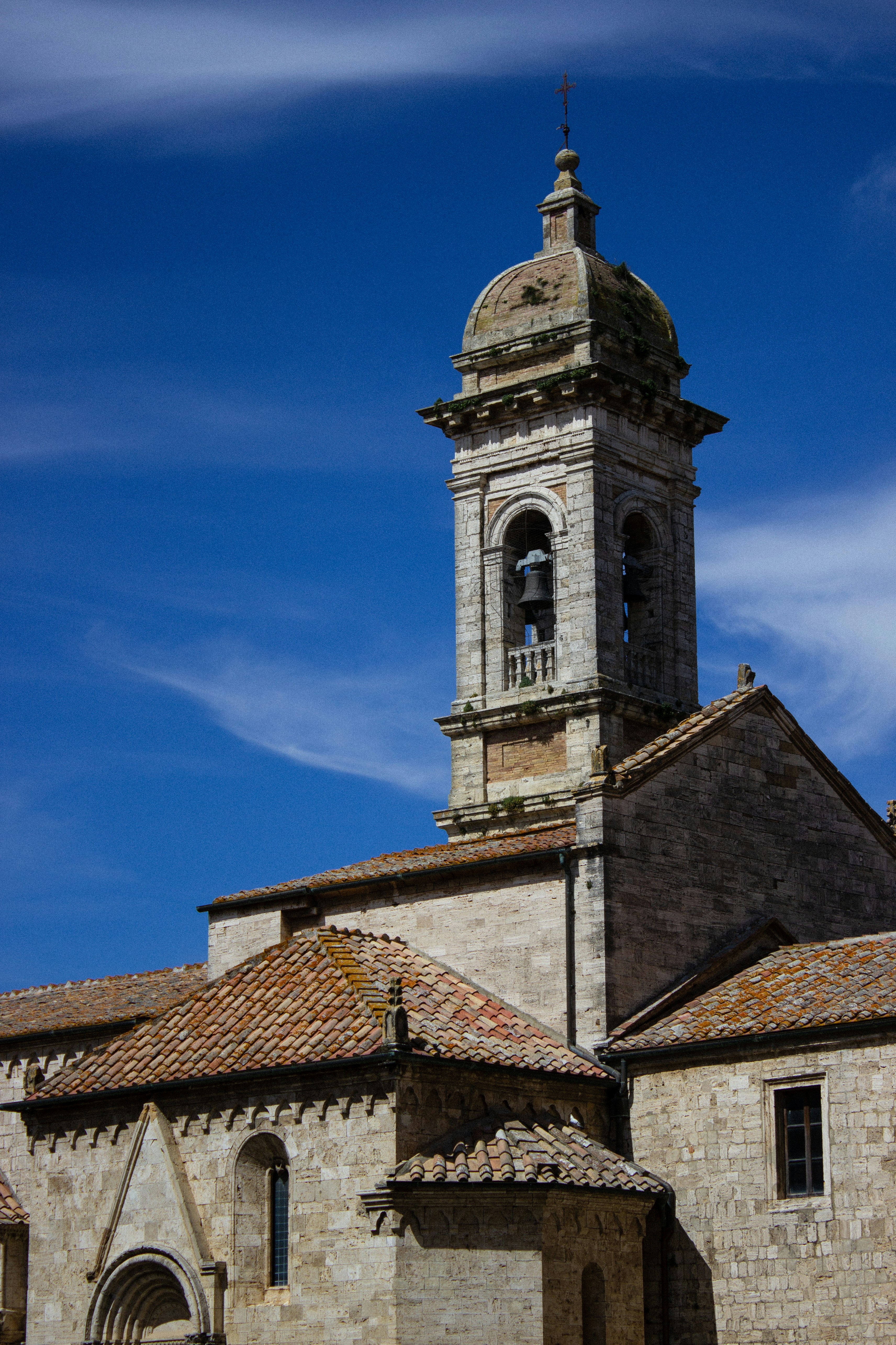 Stone Bell Tower Reaching Toward a Cerulean Sky