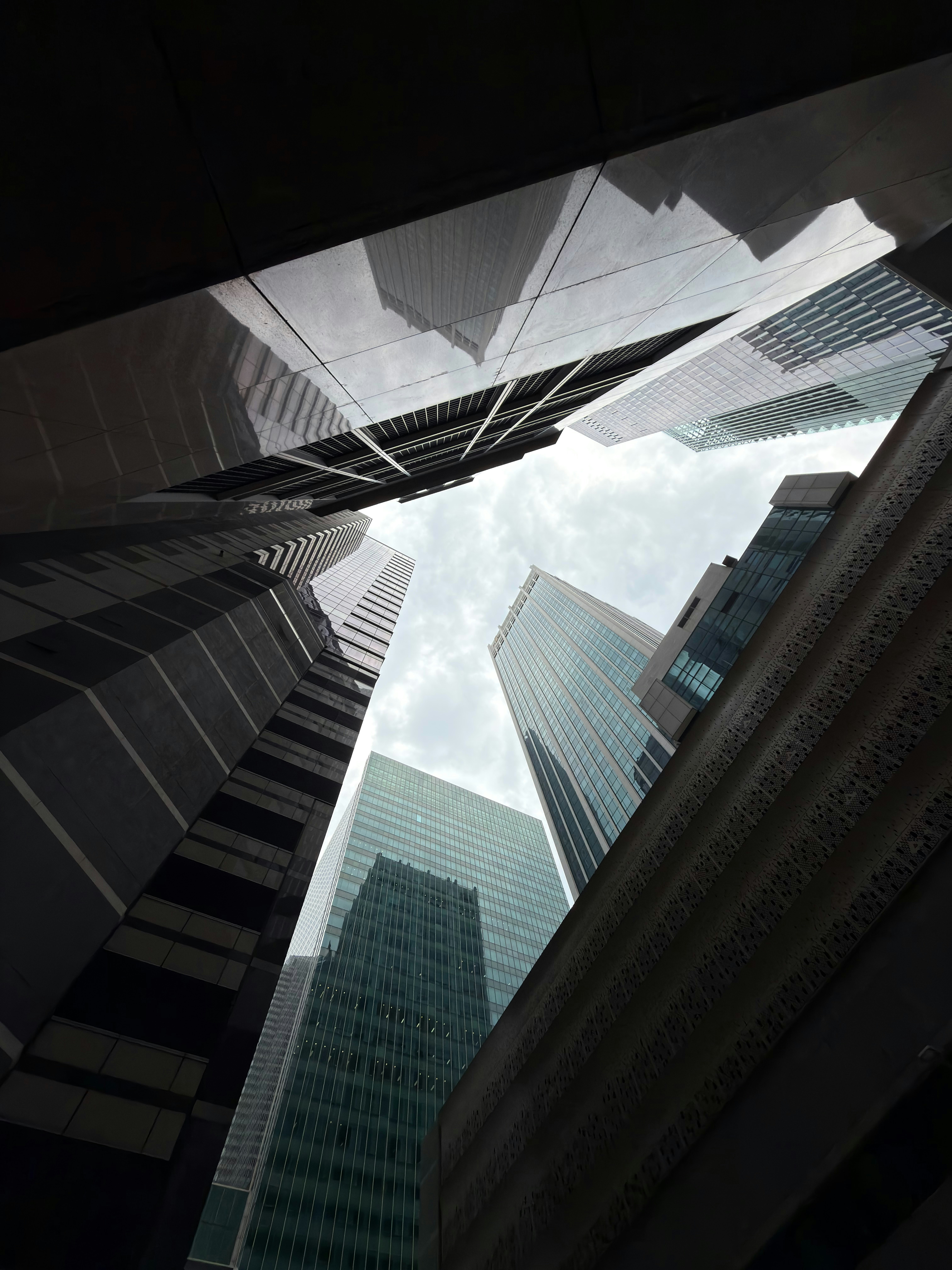 Skyward Convergence: Narrow Canyon of Glass and Steel
