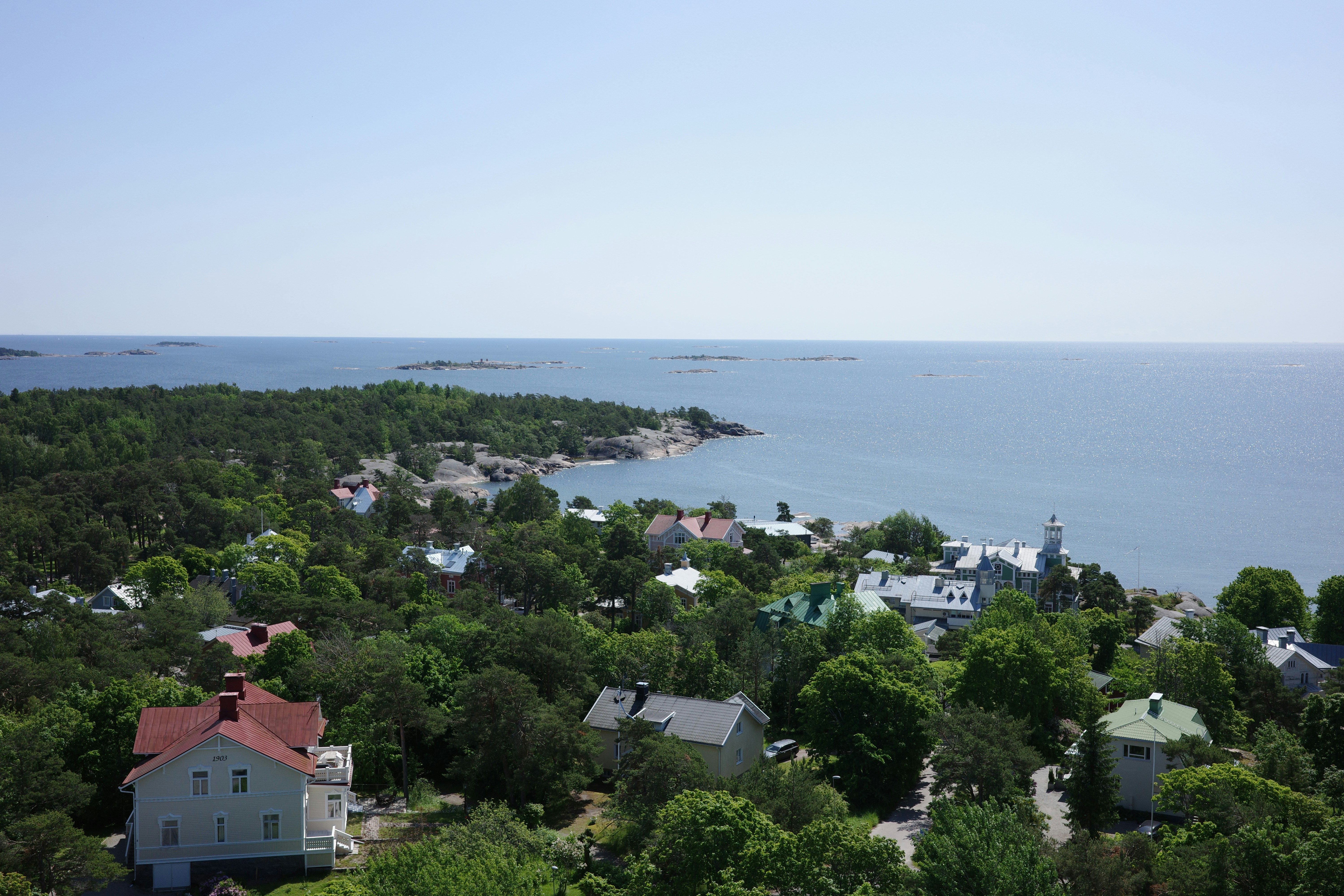 Coastal Village Nestled in Green and Blue