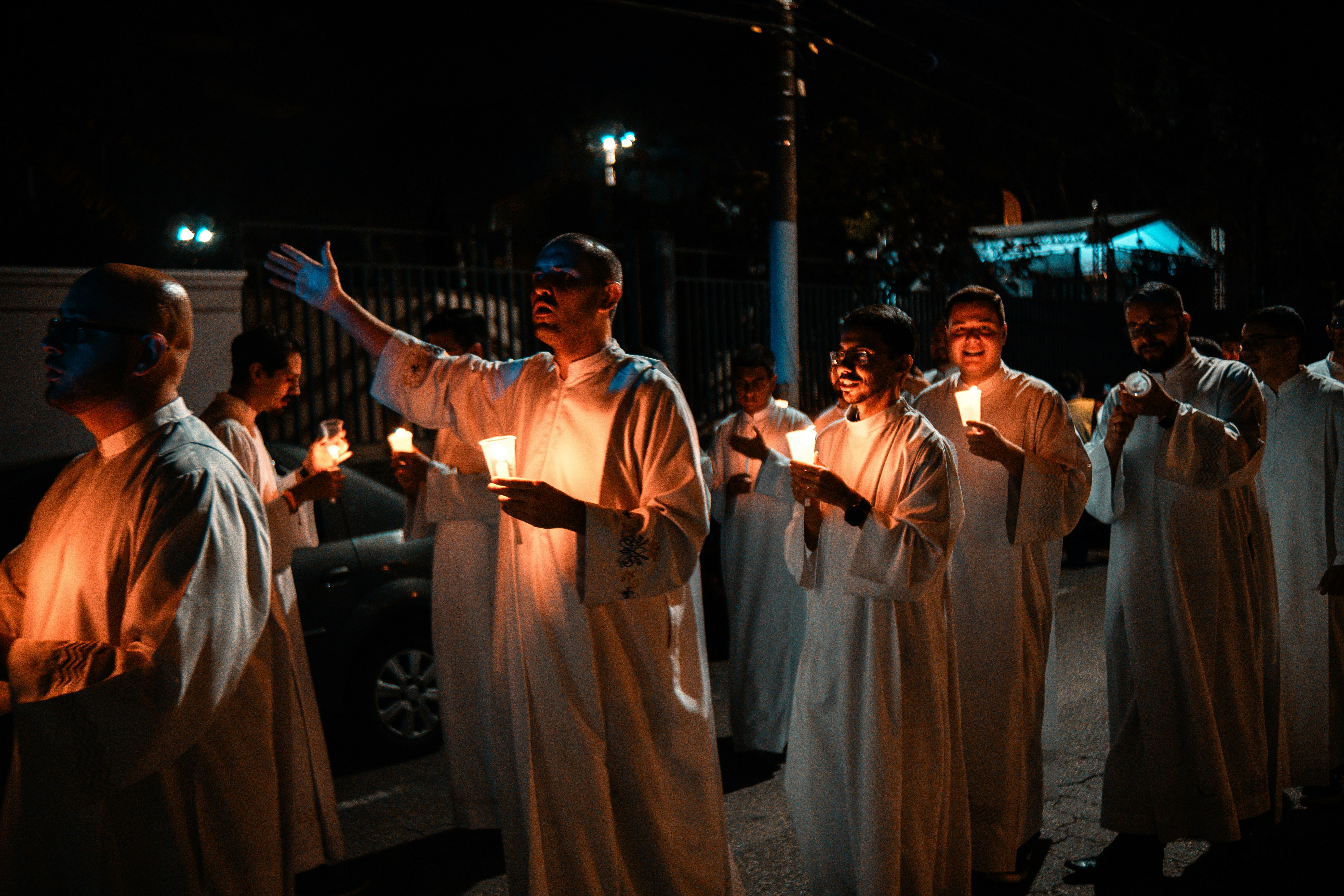 Candlelit Reverence: A Line of Silent Singers in Night Fold