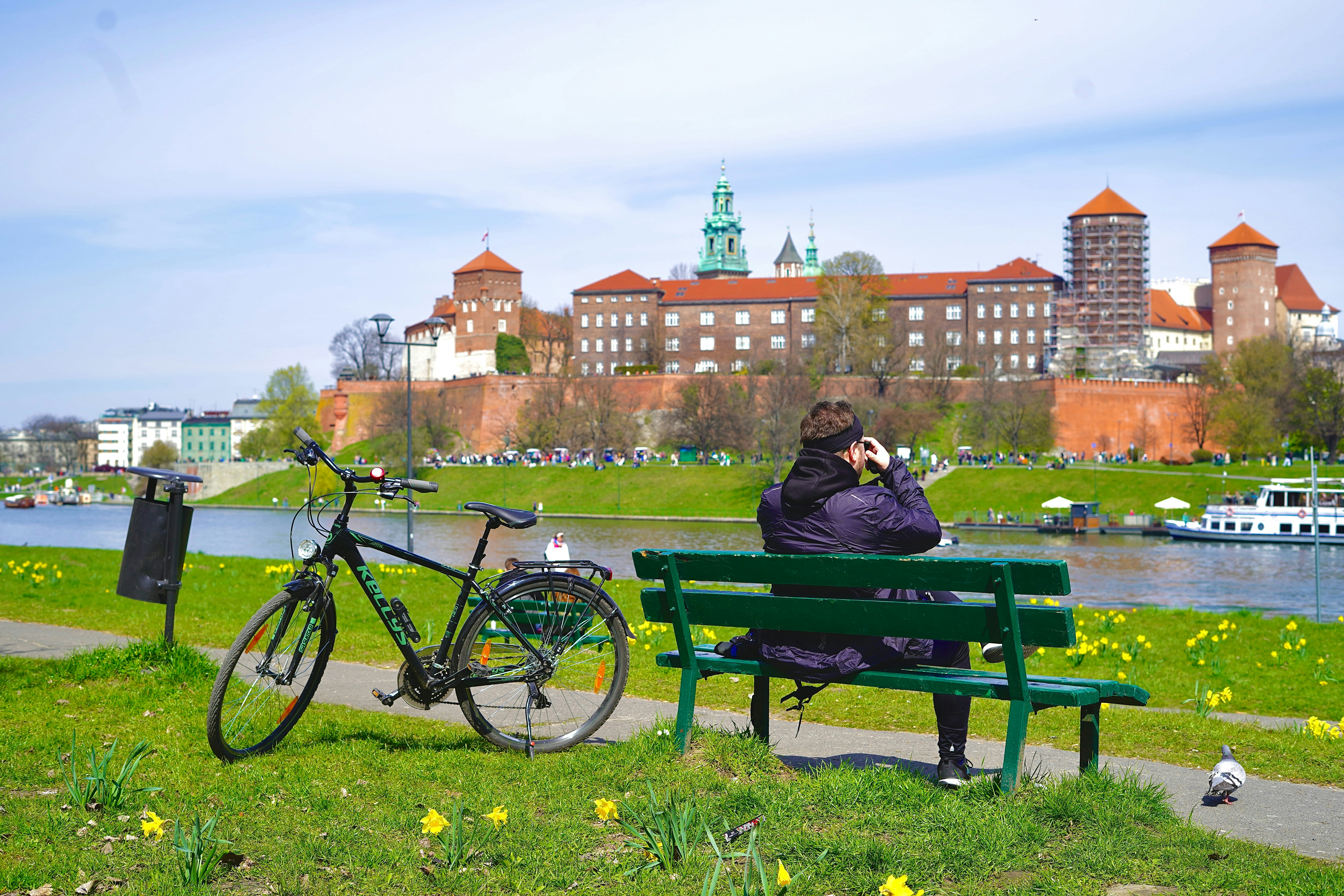 A Quiet Riverside Moment: Bike, Bench, and Castle Backdrop