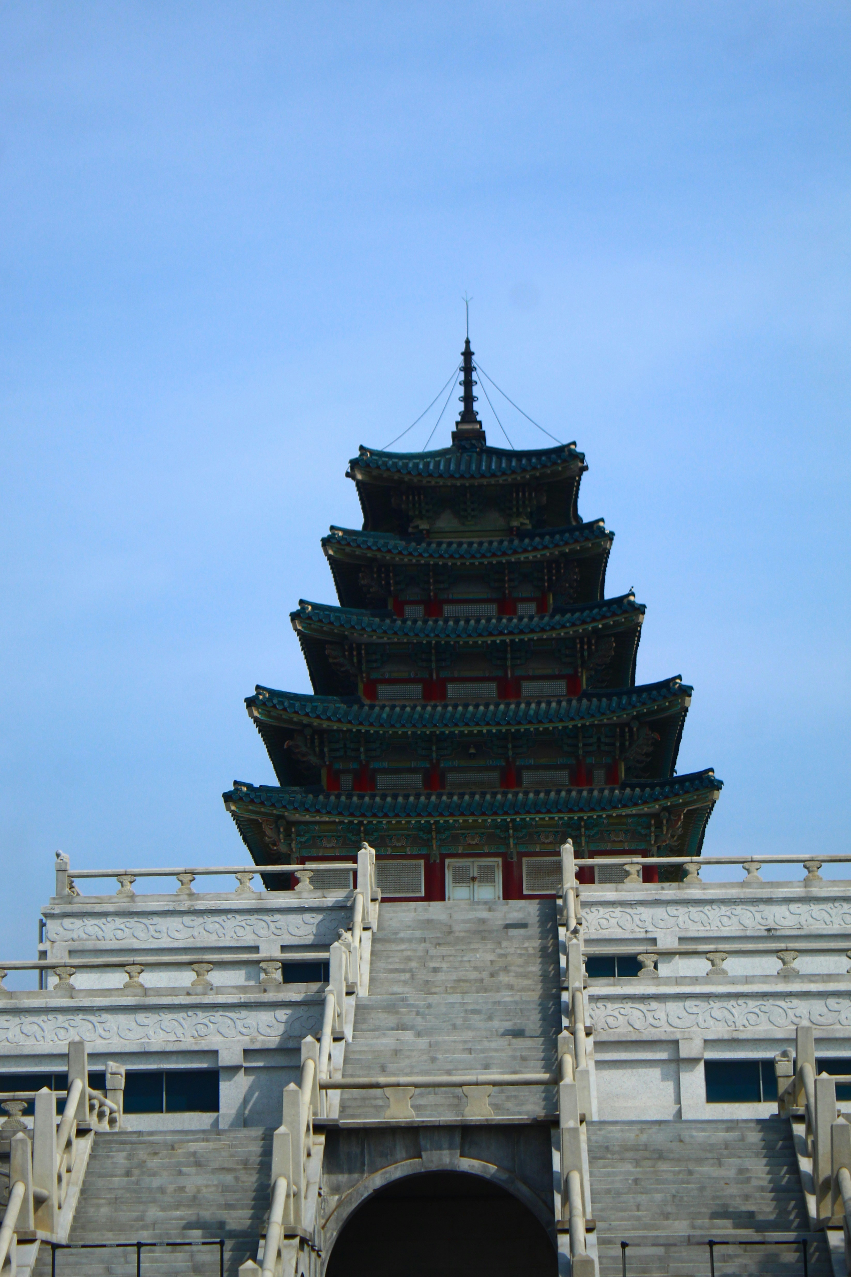 Five-Tiered Temple Rising Above Marble Staircase