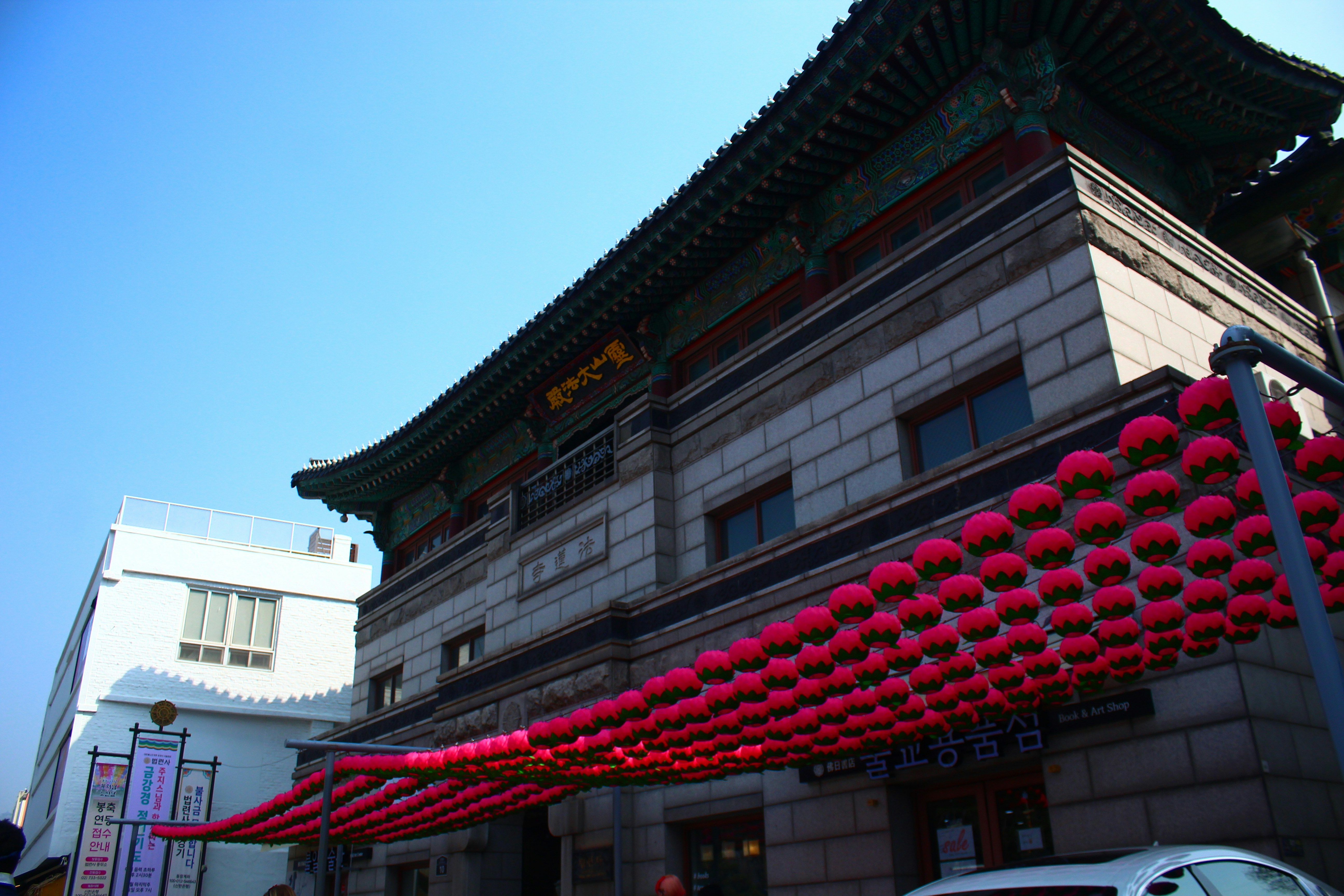 Red Lanterns Draped Across a Historic Facade