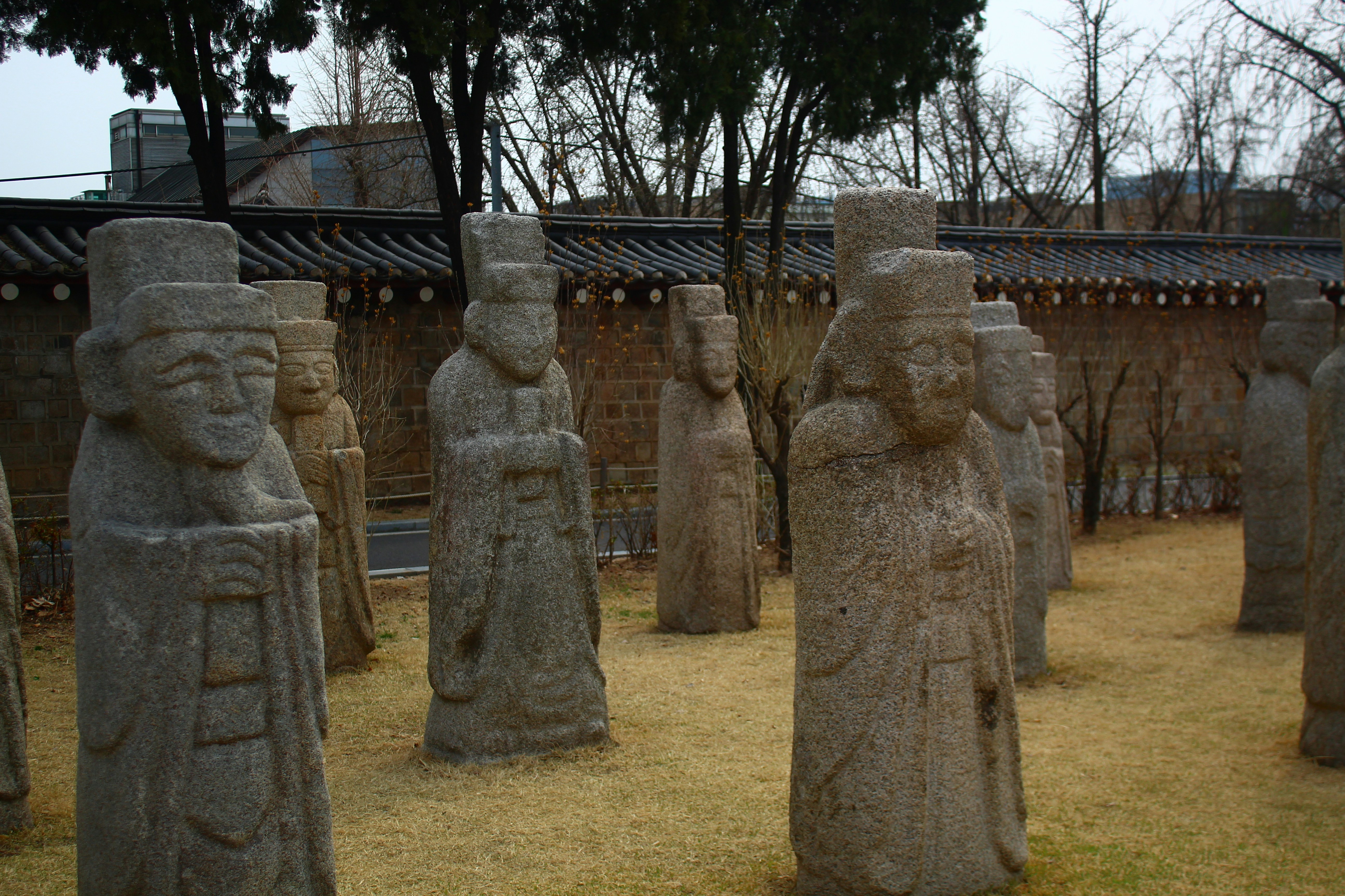 Stone Arrivals: An Array of Guardian Figures in a Quiet Courtyard
