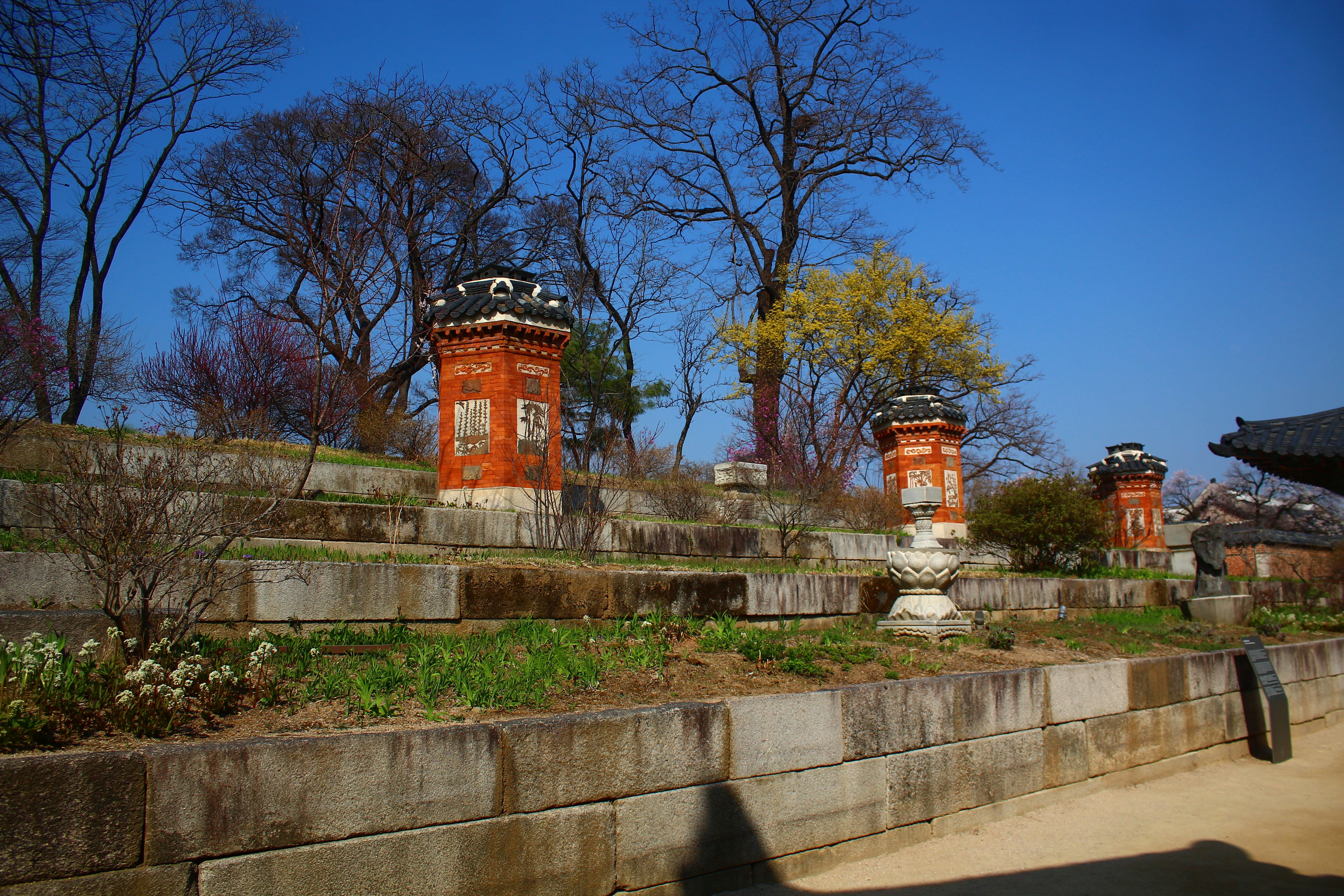 Red Stone Pagodas in Sunlit Terrace