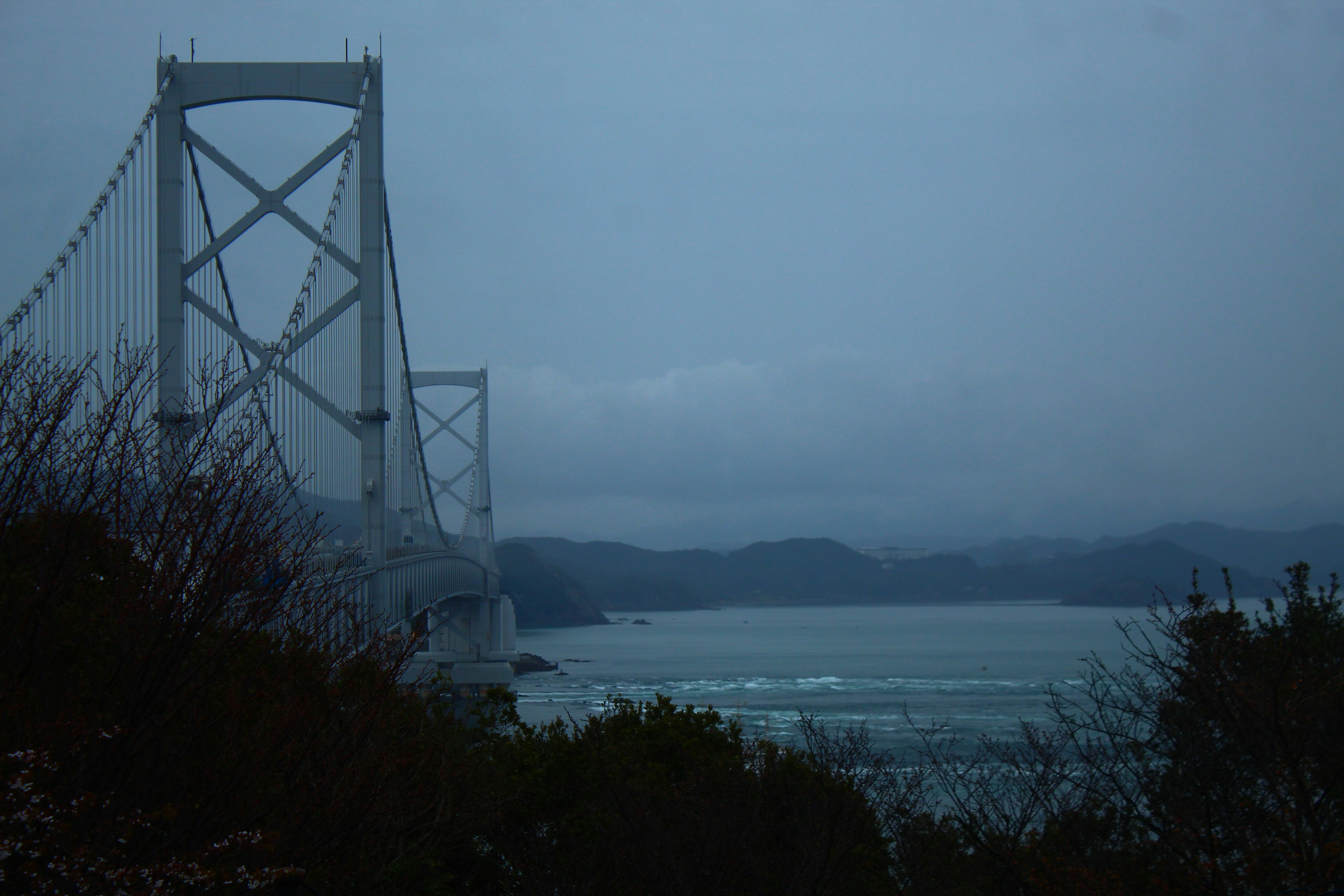 Blue Hour Bridge Looms Over Quiet Water