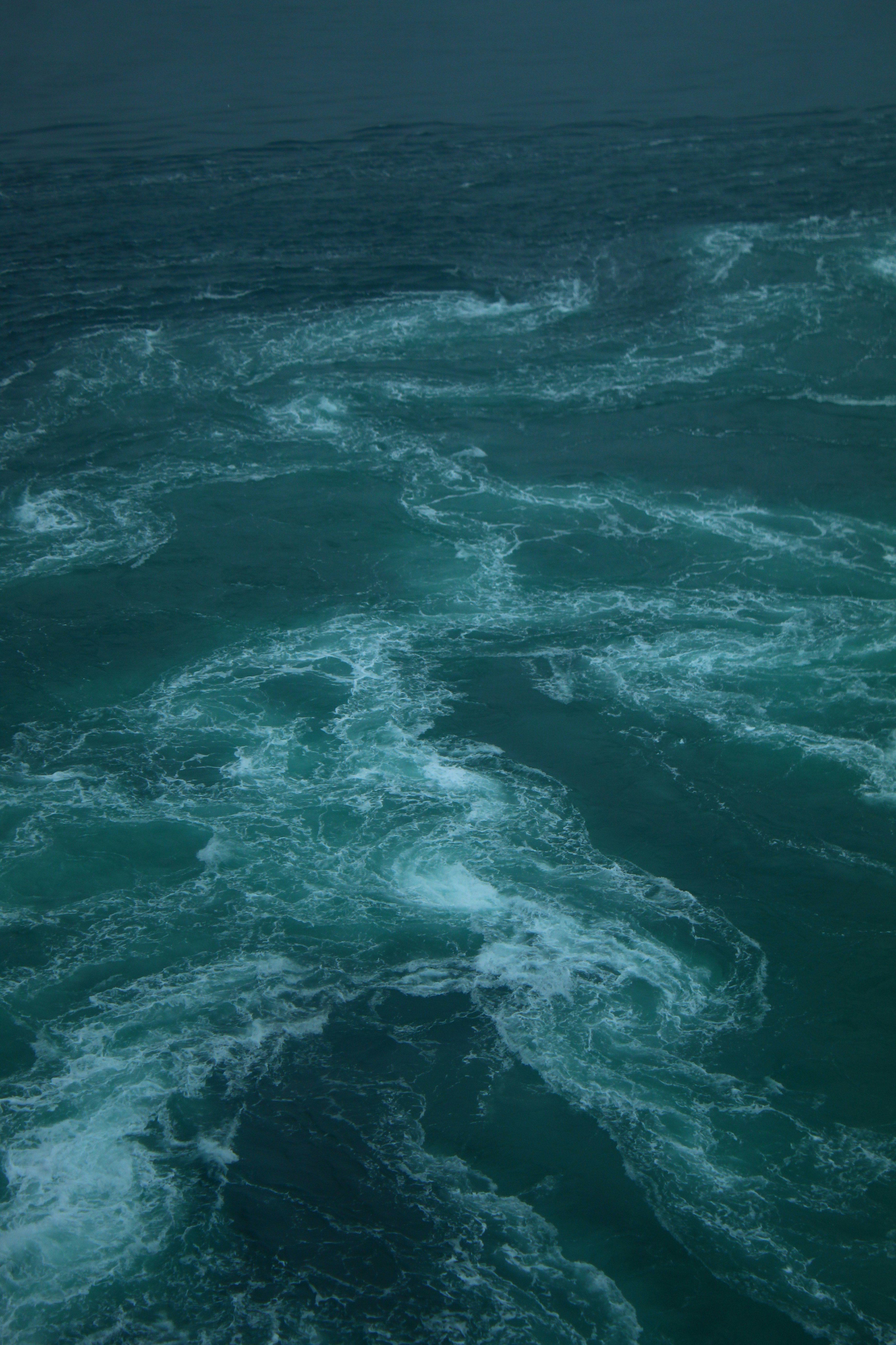 Azure Currents: A Vertical Dive into Turquoise Swells