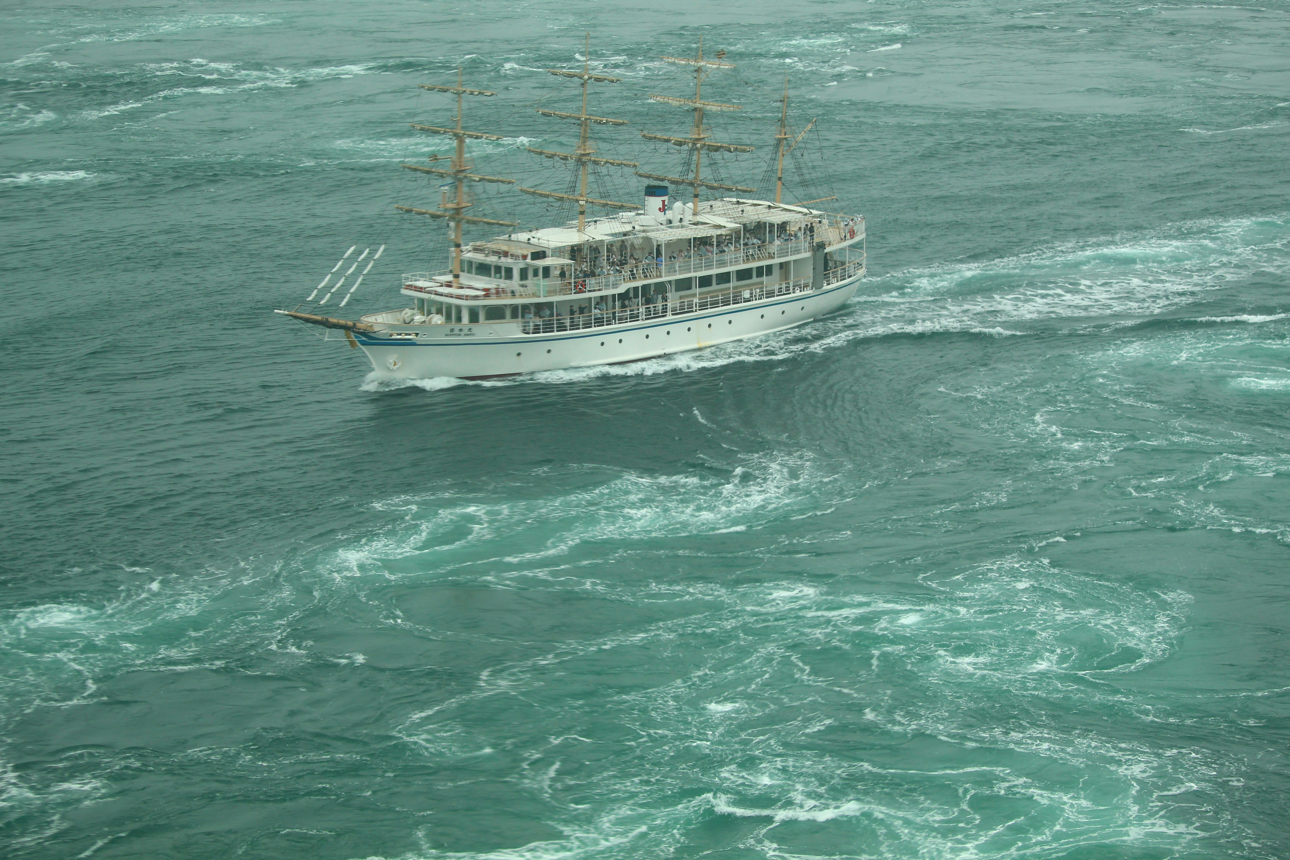 Sailing Majesties: A Heritage Vessel Cutting Through Turquoise Seas