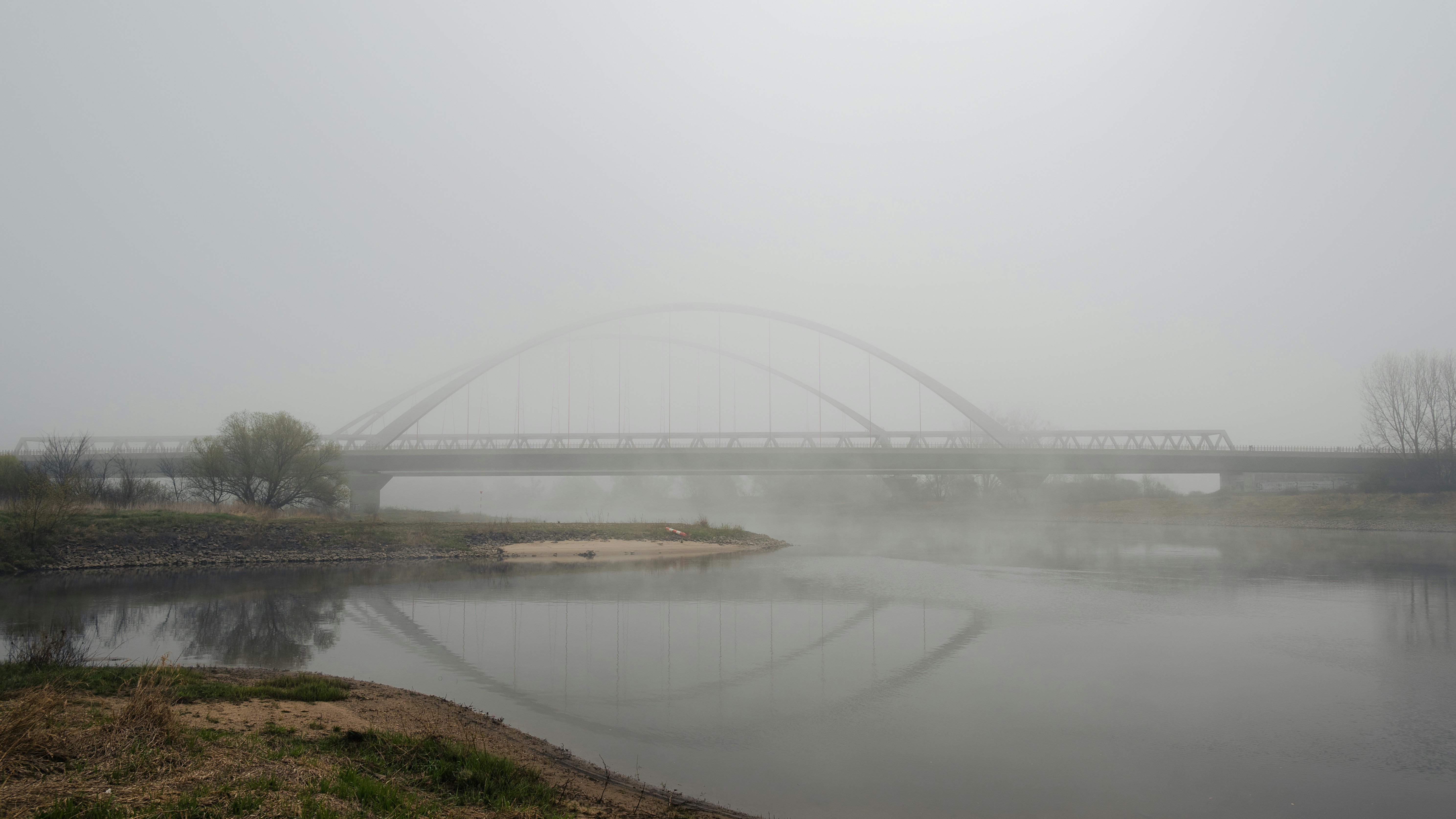 Bridge in the Mist: A Quiet Arc Across the River