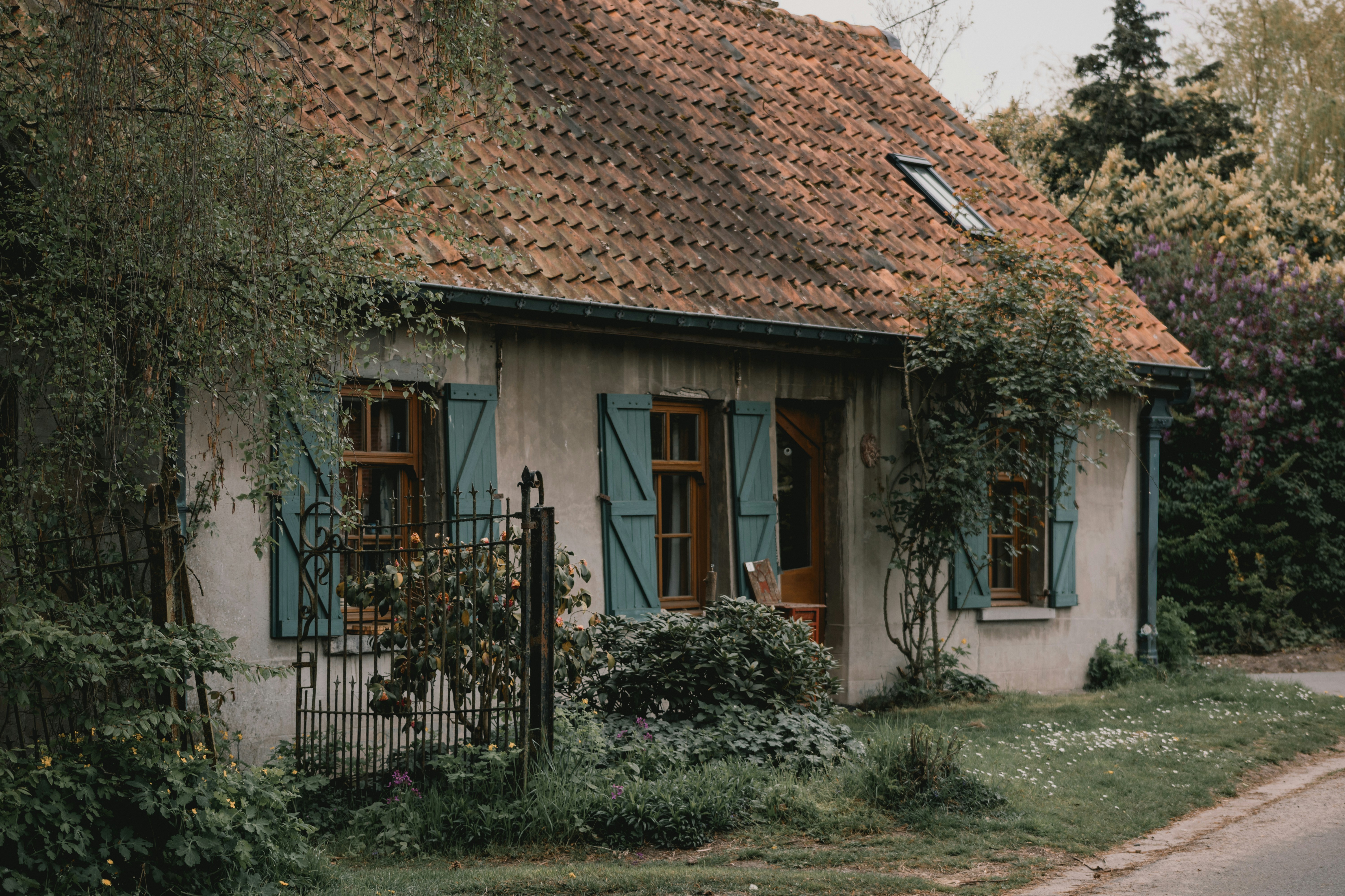 Cottage in Blooming Garden with Turreted Roof