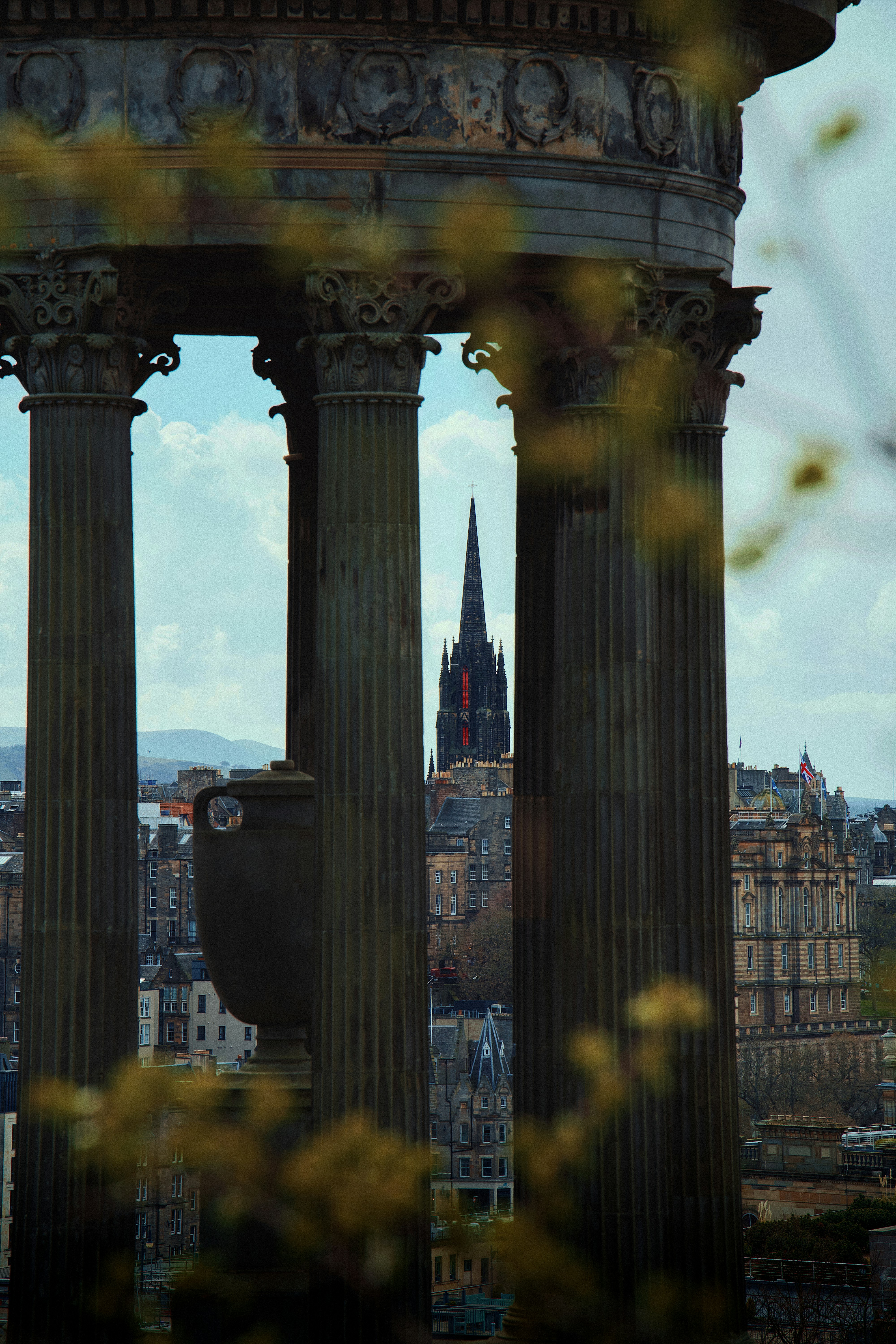Through the Ancients: City Skyline Framed by Classical Columns