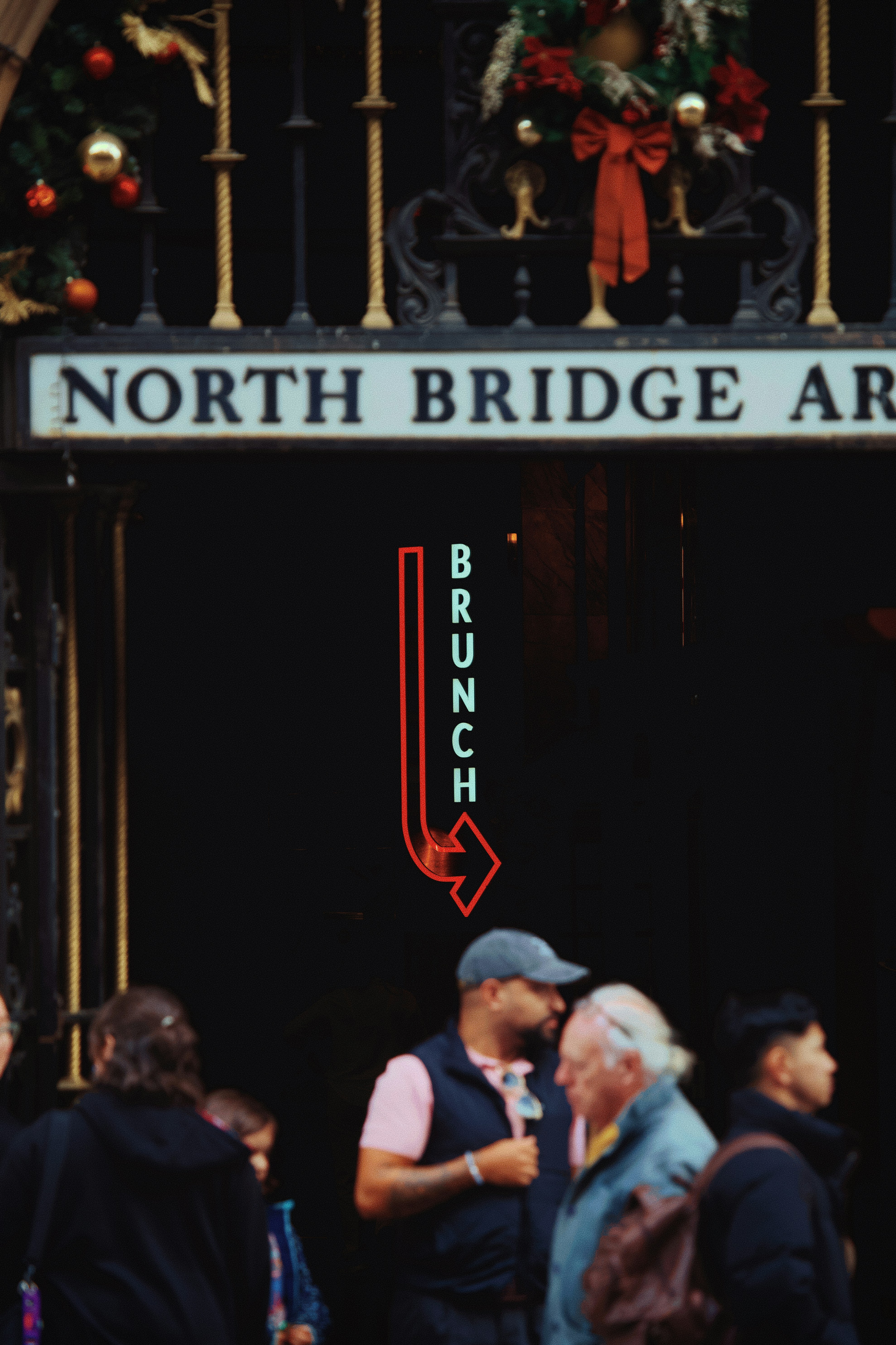 Neon Sign and festive glow beneath North Bridge Arch