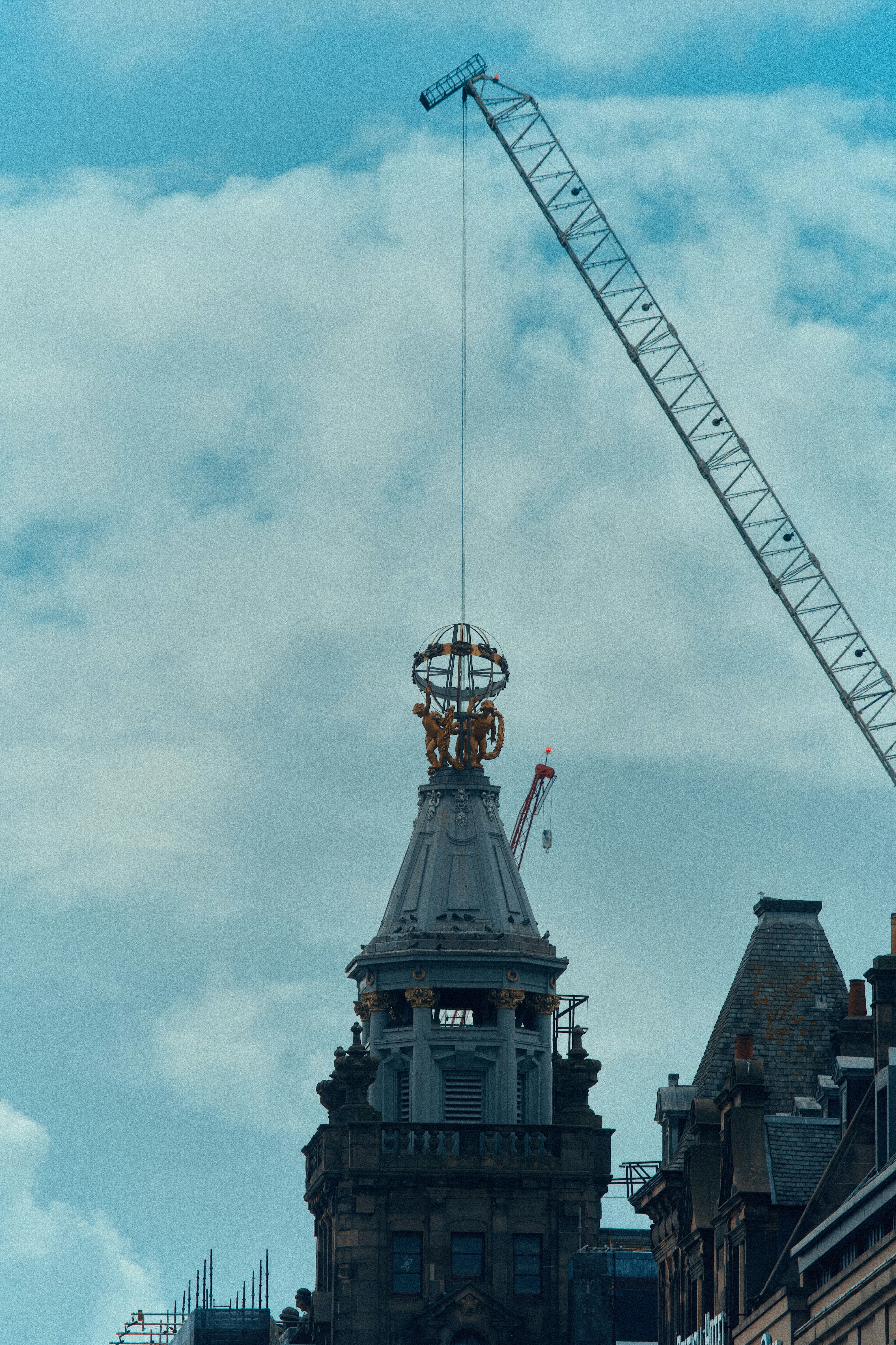 Craned Crown: A Historic Turret Raised Under Sky