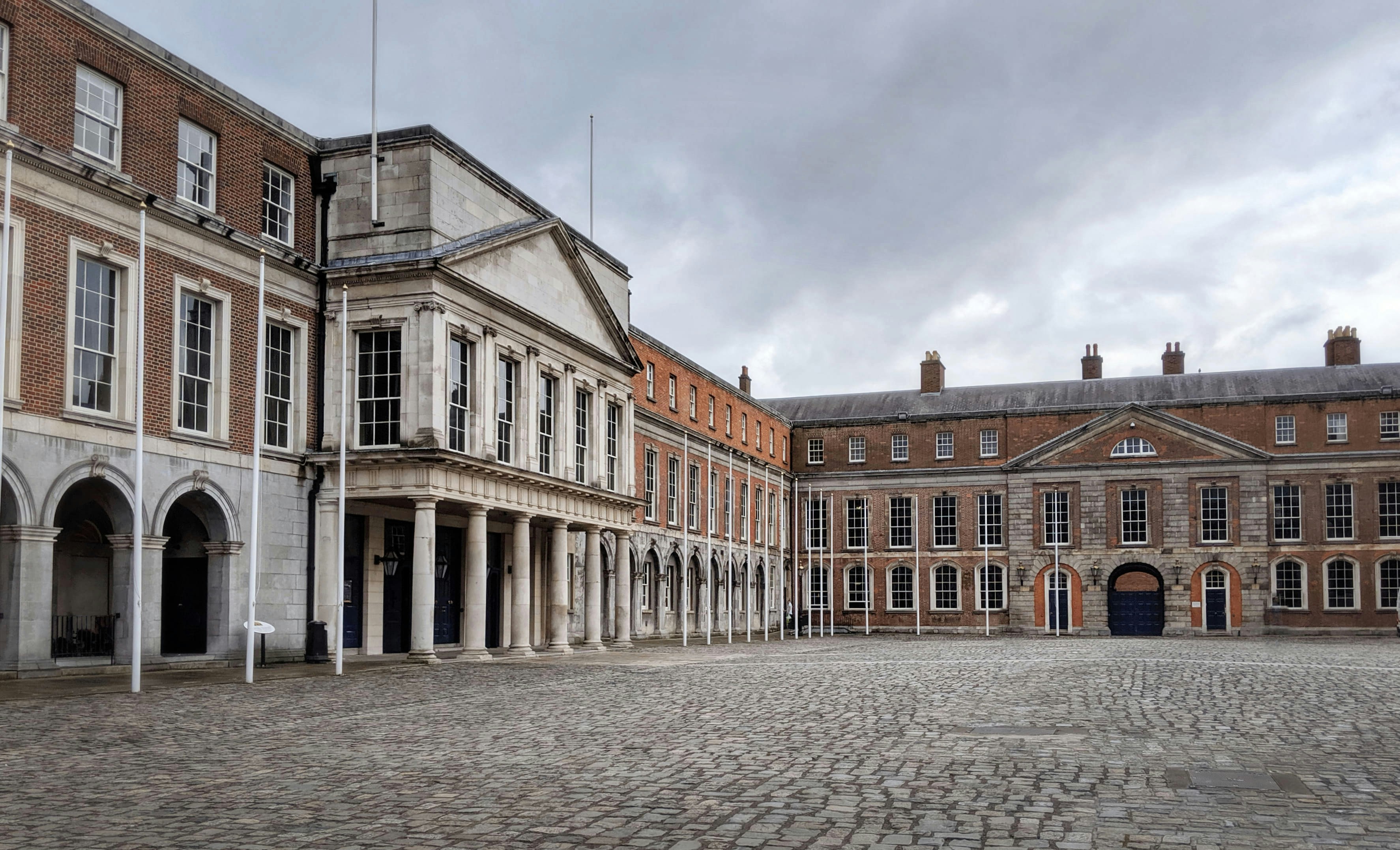 Courtyard of Quiet Stone: A Historic Unity of Brick and Arch