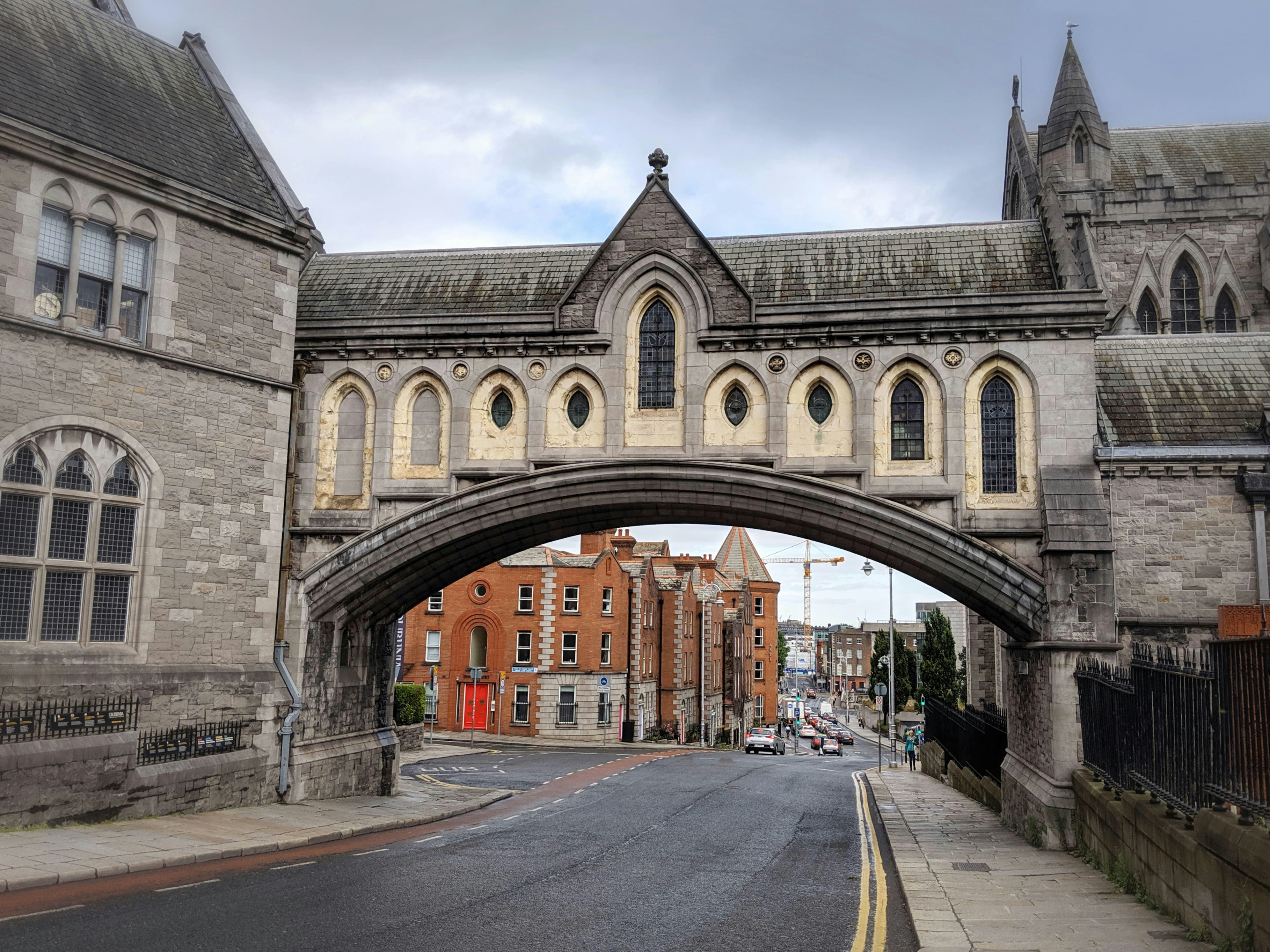 Stone Archway Over a Quiet Street into a Red Brick Town