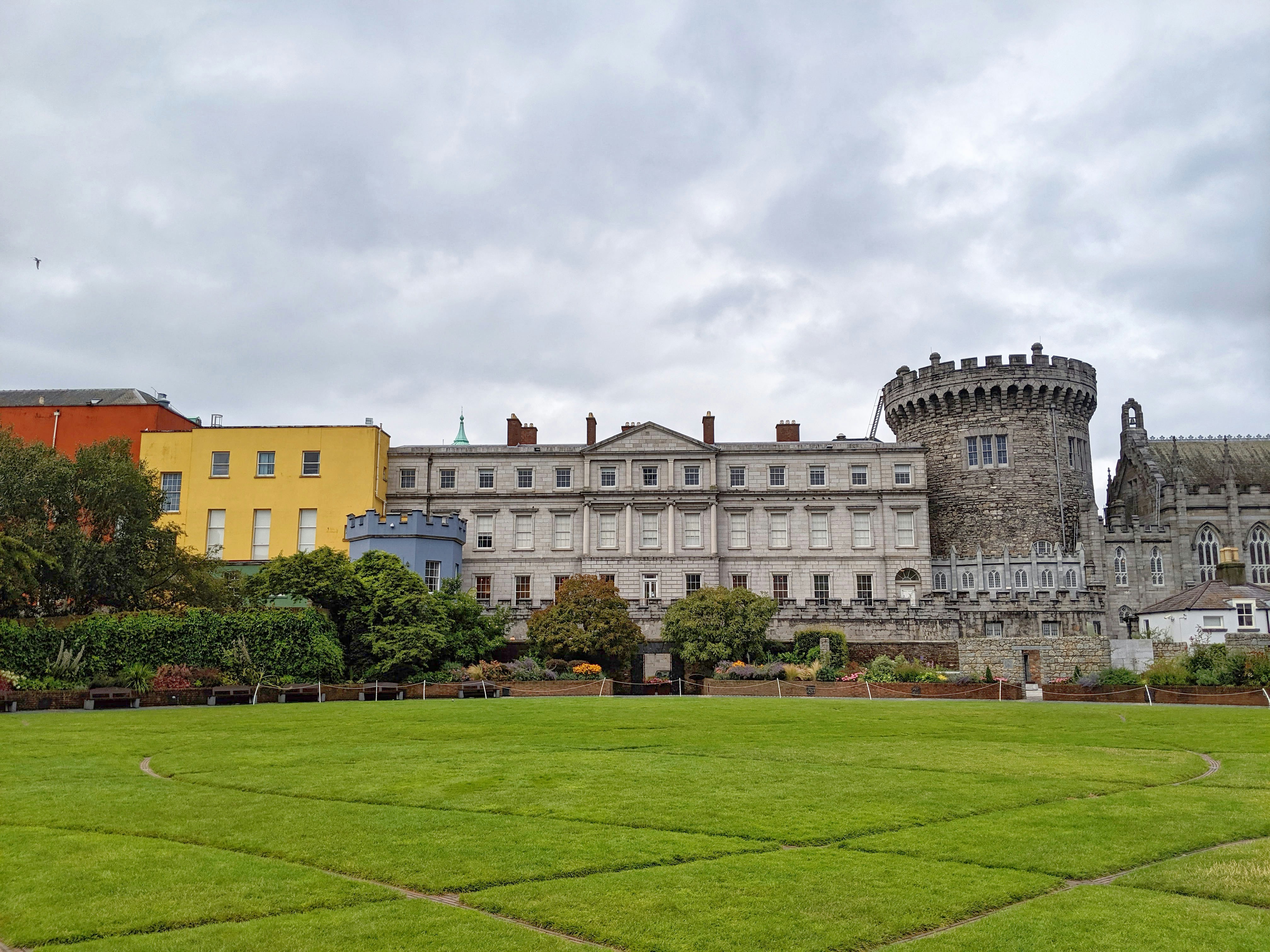Pastel Row and Fortress Skyline Over a Velvet Lawn