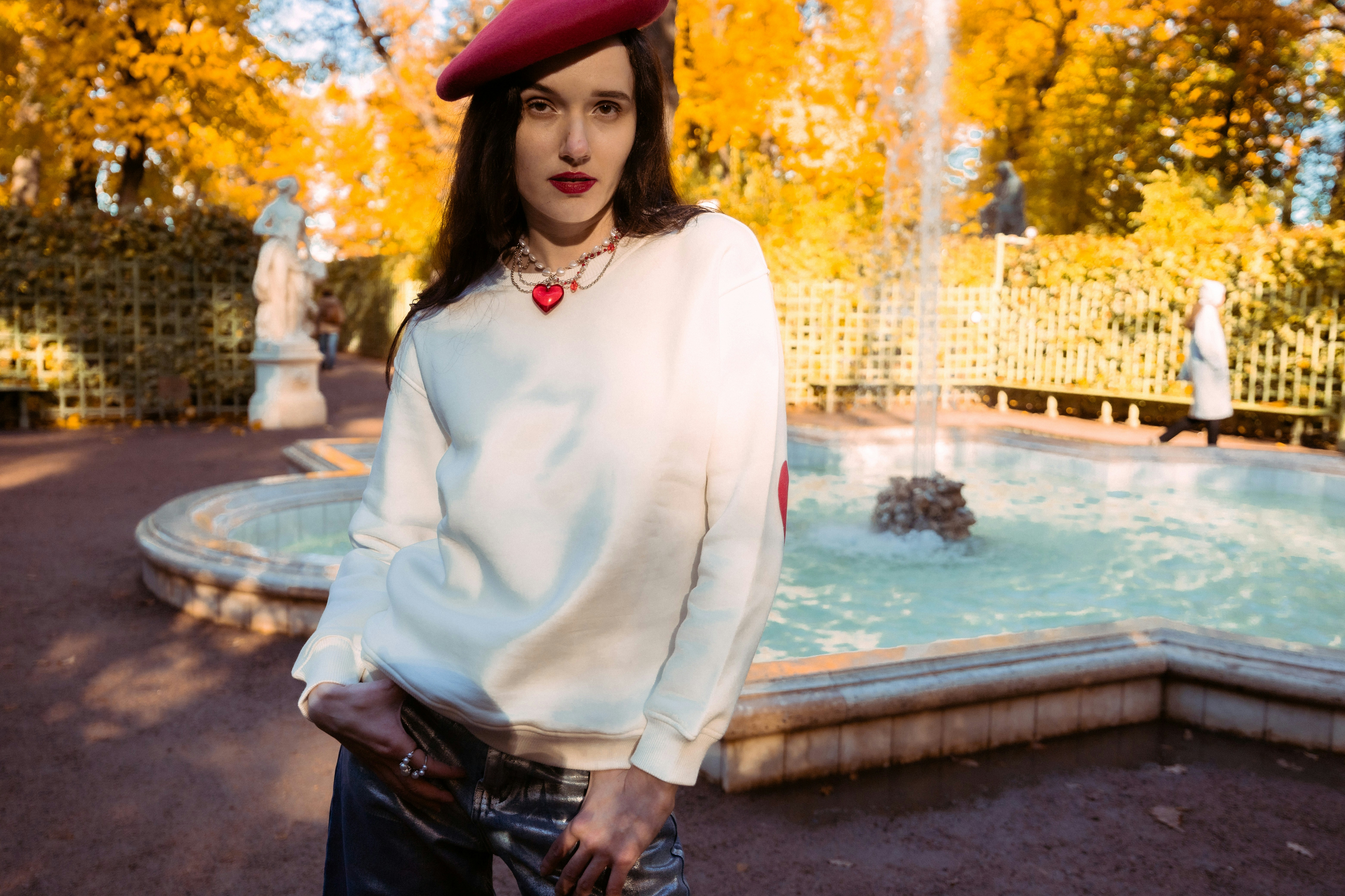 Red Beret, Autumn Lights: A Portrait by the Fountain