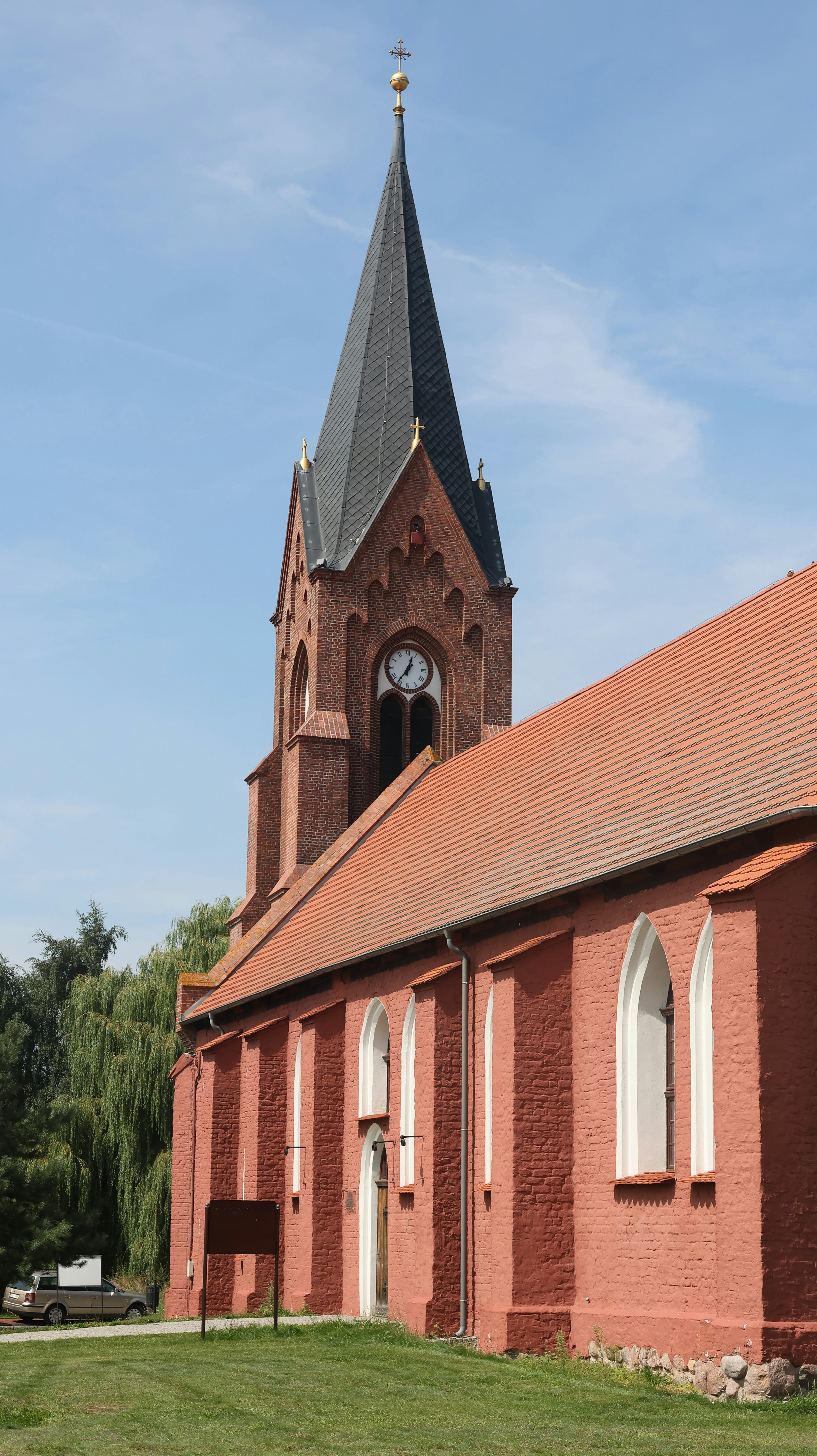 Brick Church Tower Reaching Toward a Clear Sky