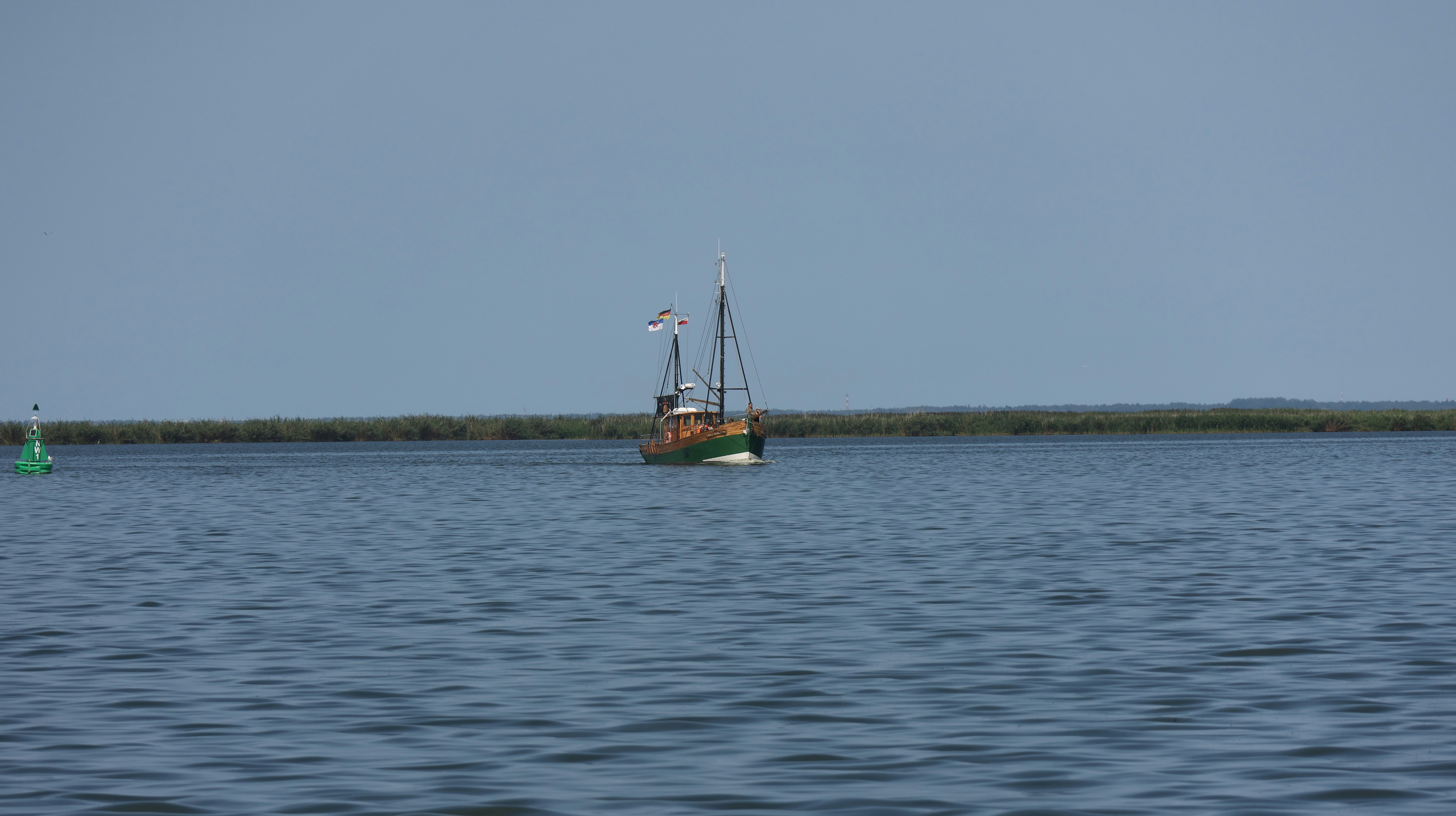 Coastal Vessel on a Calm Open Water