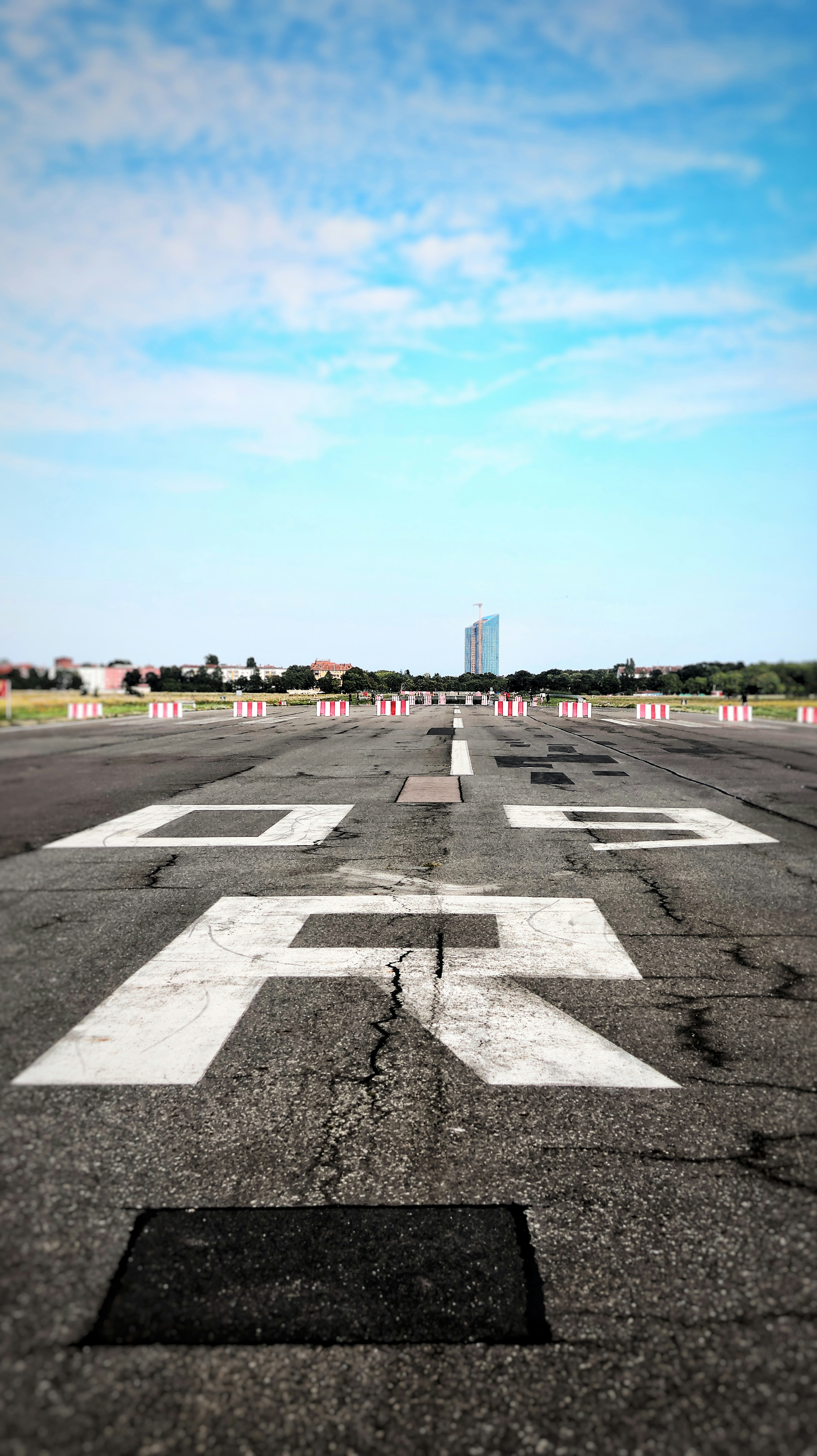 Runway to Skyline: A Long Perspective on a Quiet Tarmac