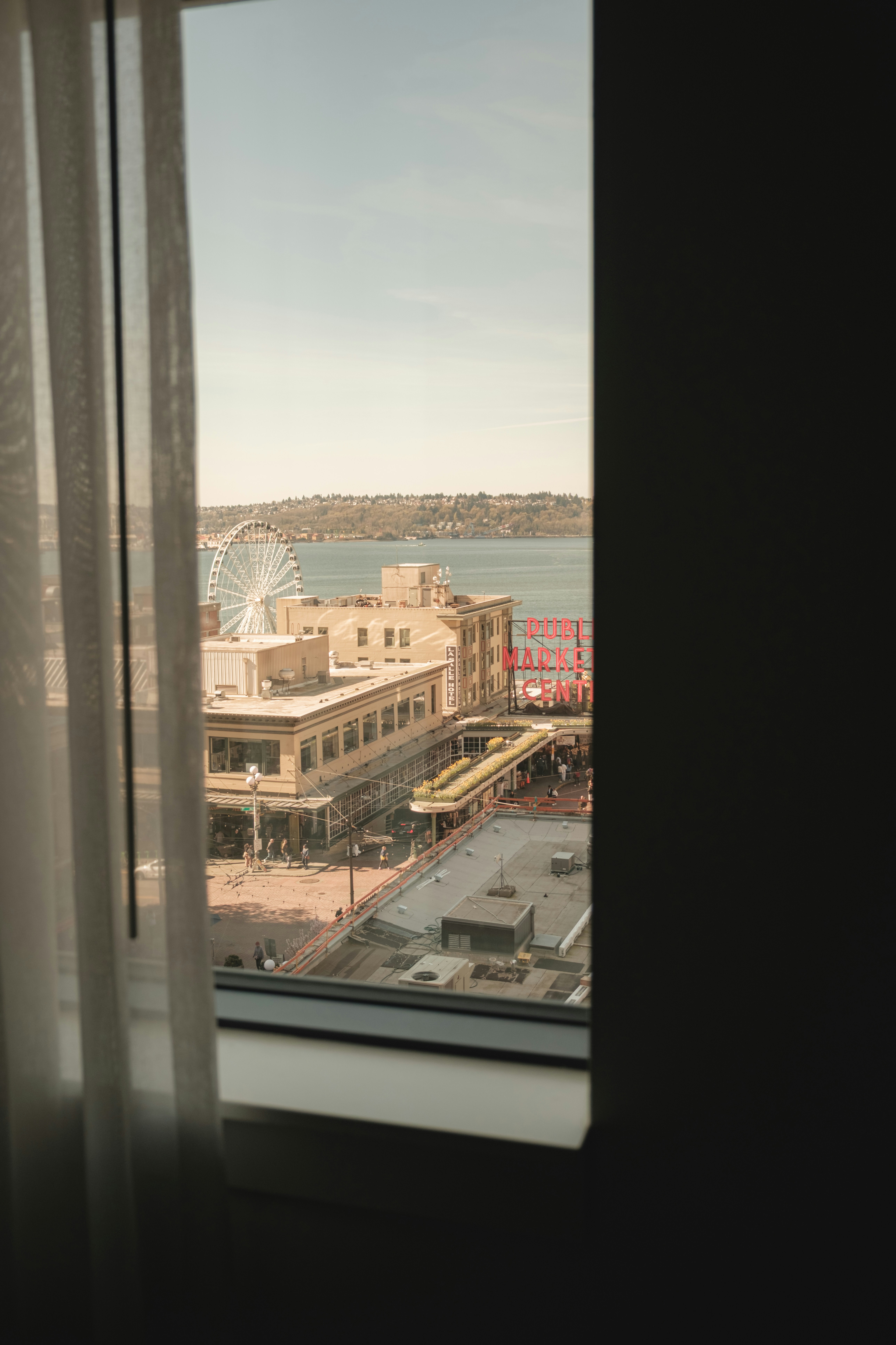 Cityscape through a hotel window at sunset