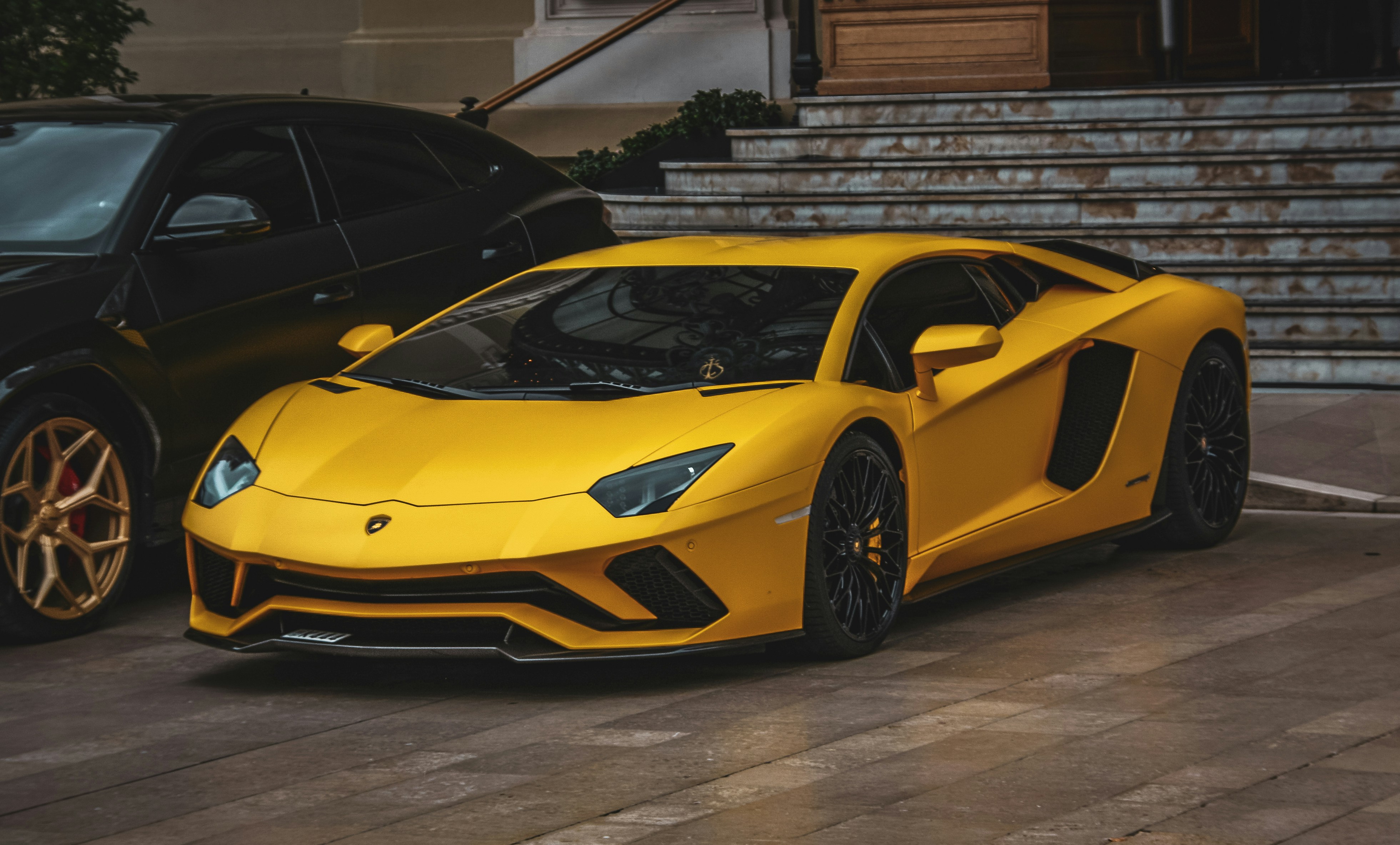Sunlit Vigor: A Yellow Lamborghini Stands Bold on City Pavement