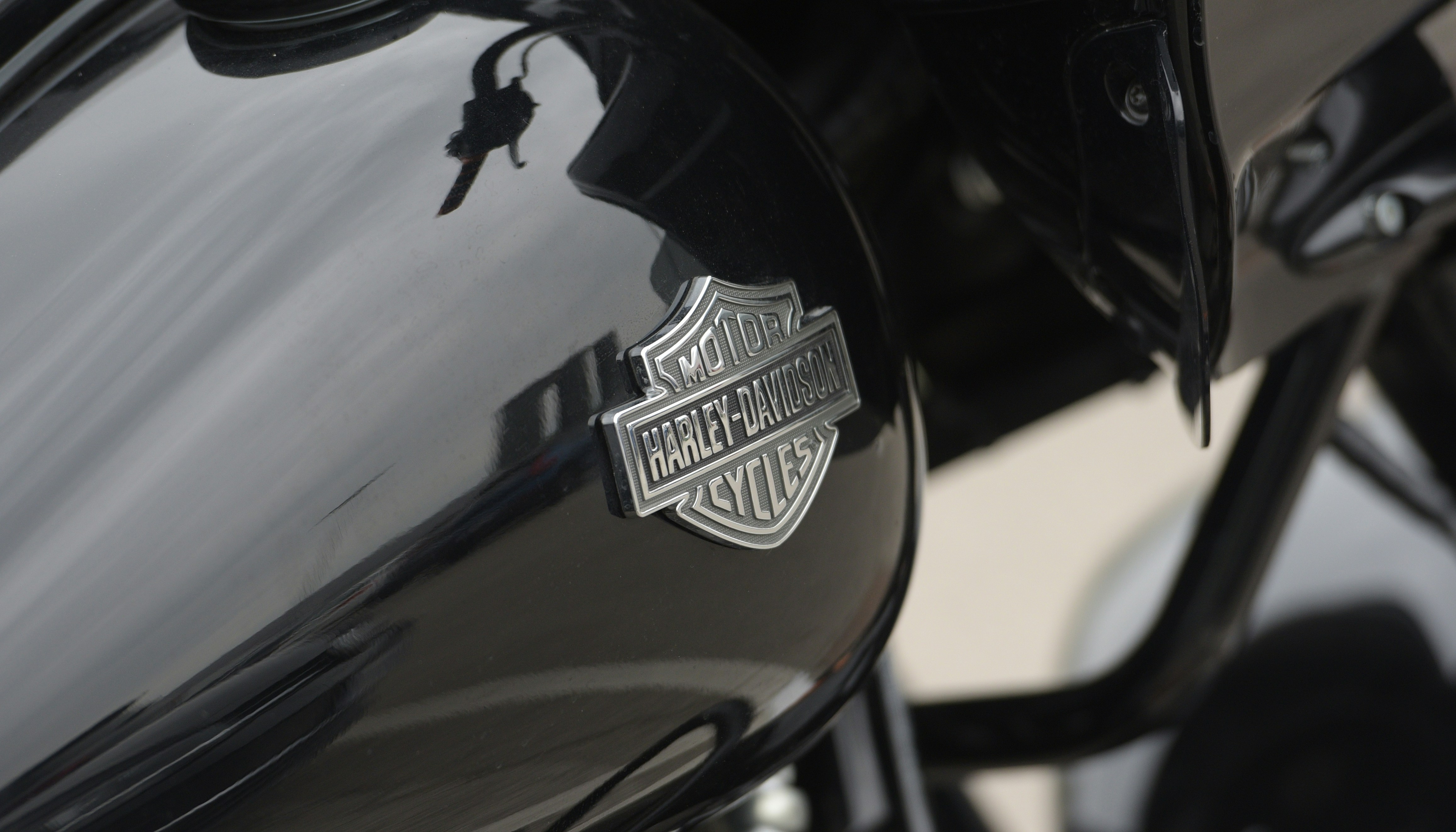 Harley‑Davidson Emblem: Shiny Badge on a Black Tank
