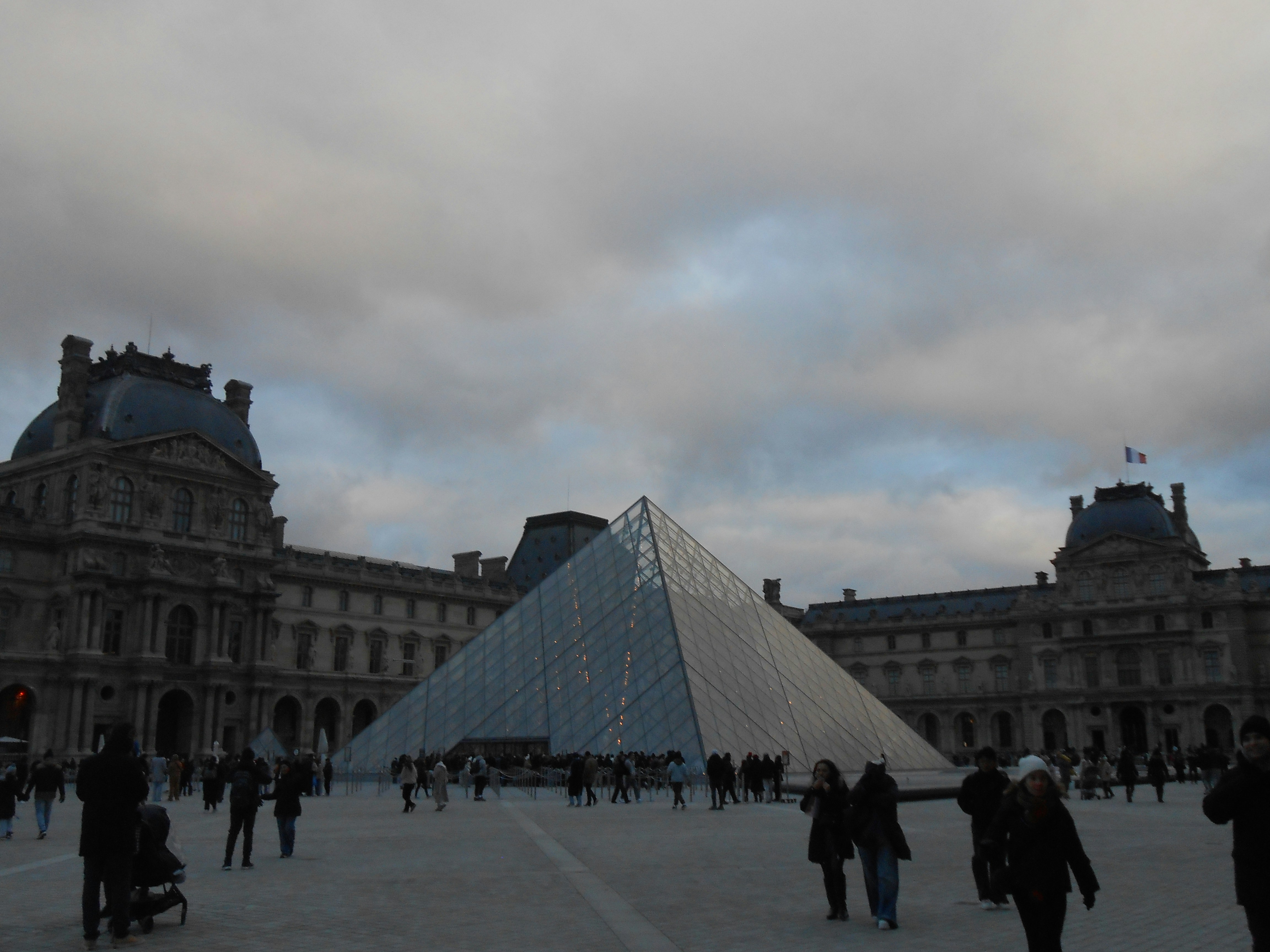 Glass Pyramid at the Louvre: Evening Footsteps Across the Courtyard